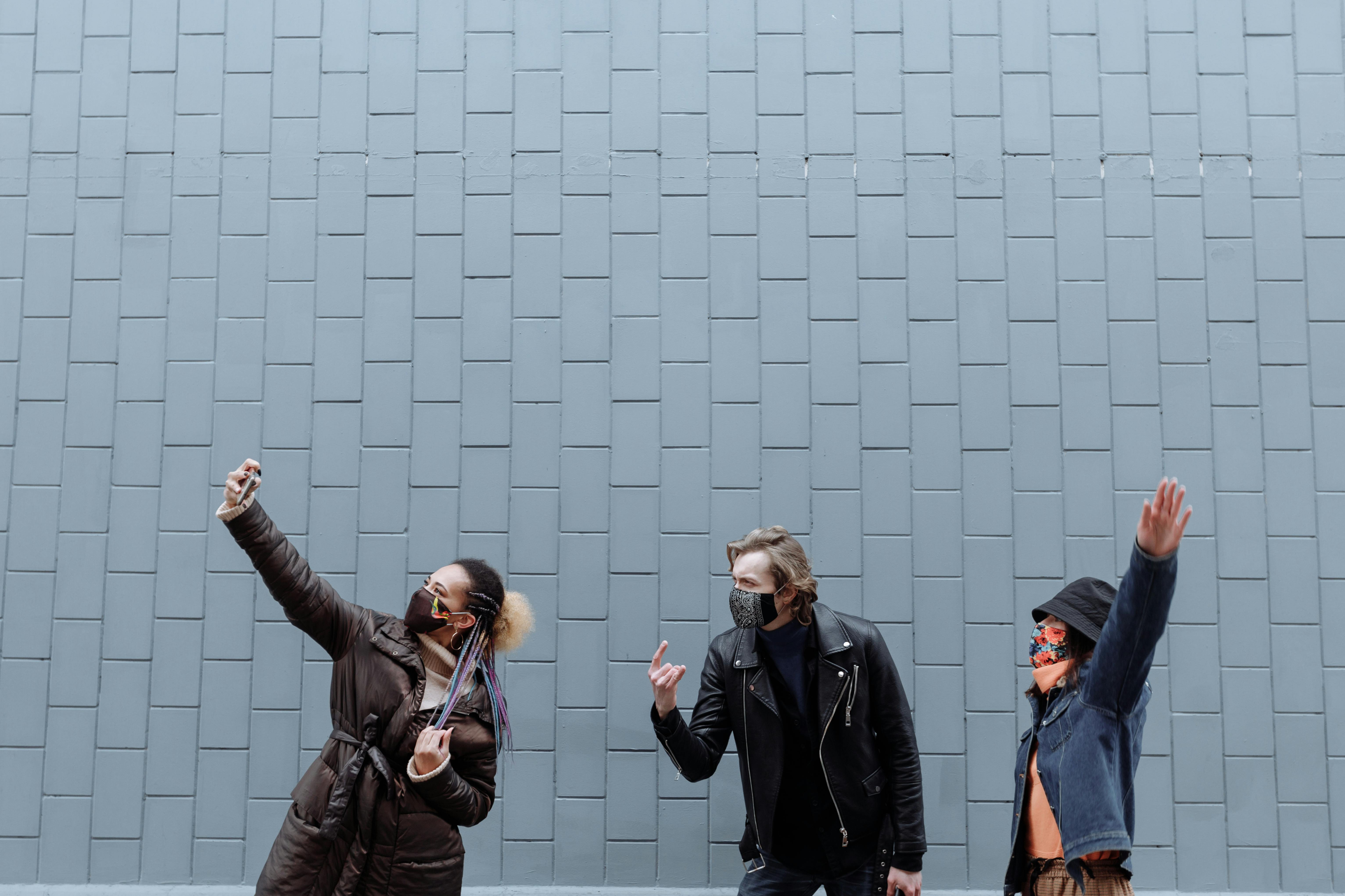 People Wearing Face Masks Taking a Picture · Free Stock Photo