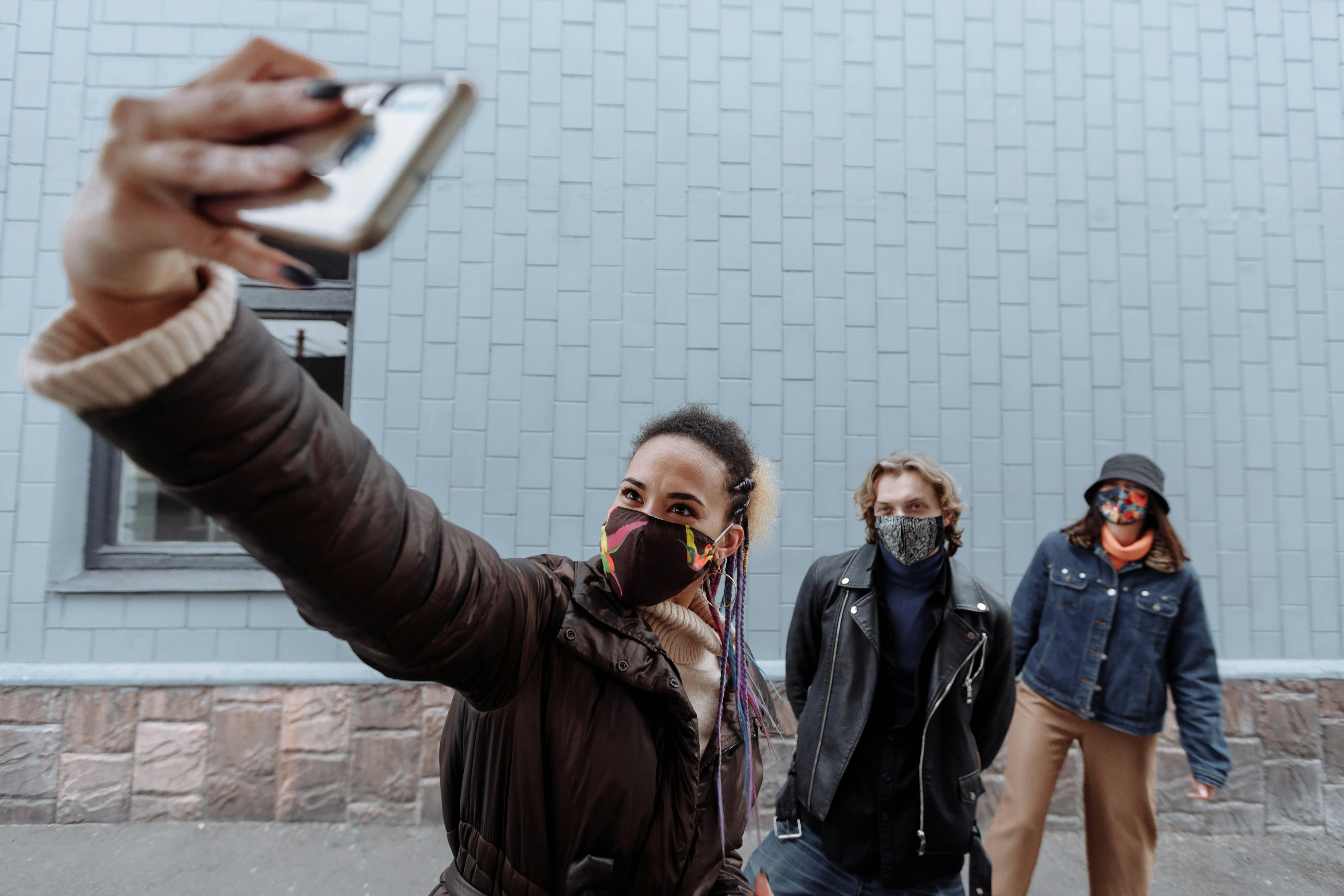 People Wearing Face Masks Taking a Picture · Free Stock Photo