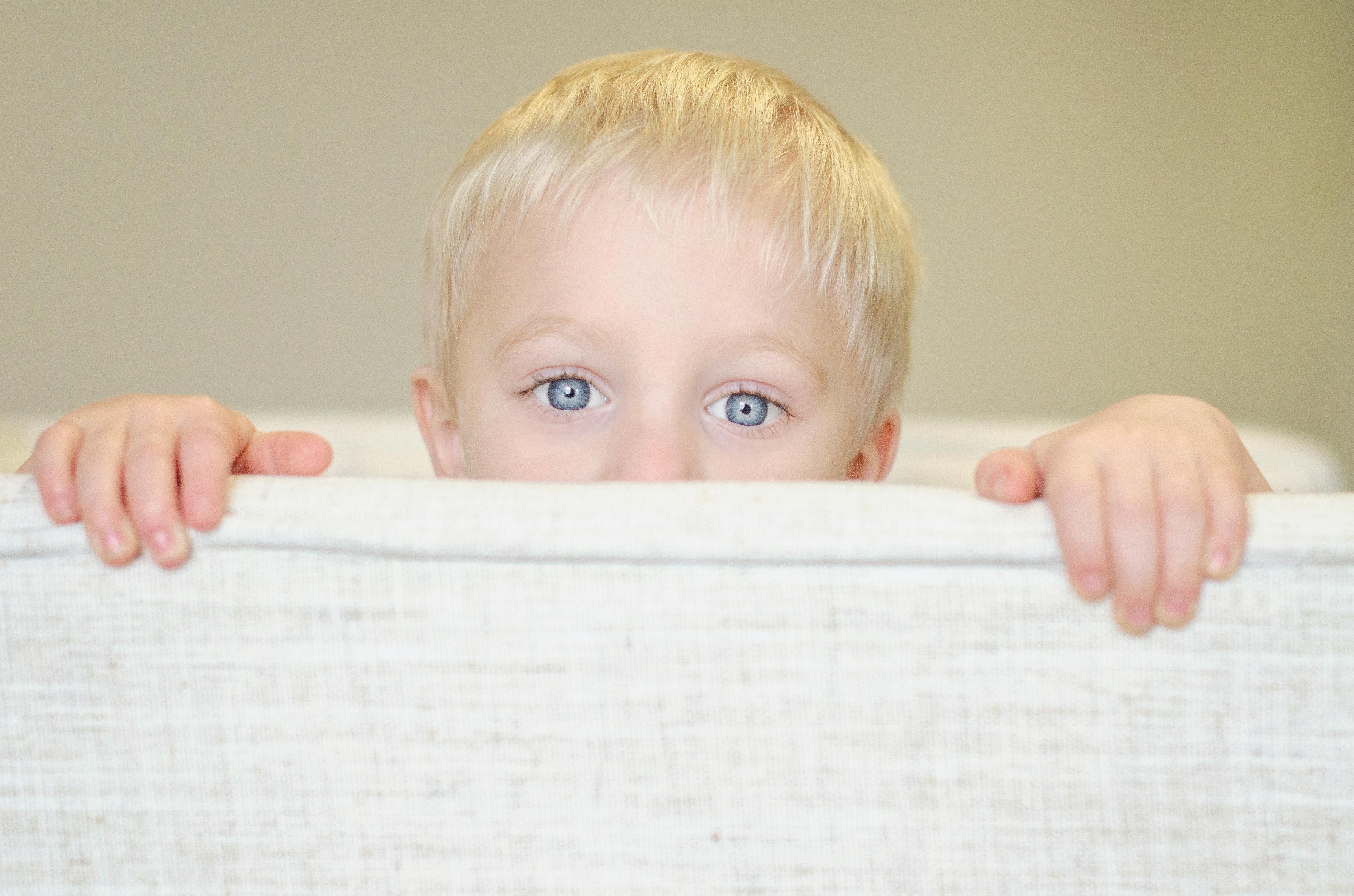 A Close-Up Shot of a Boy PeeKing · Free Stock Photo