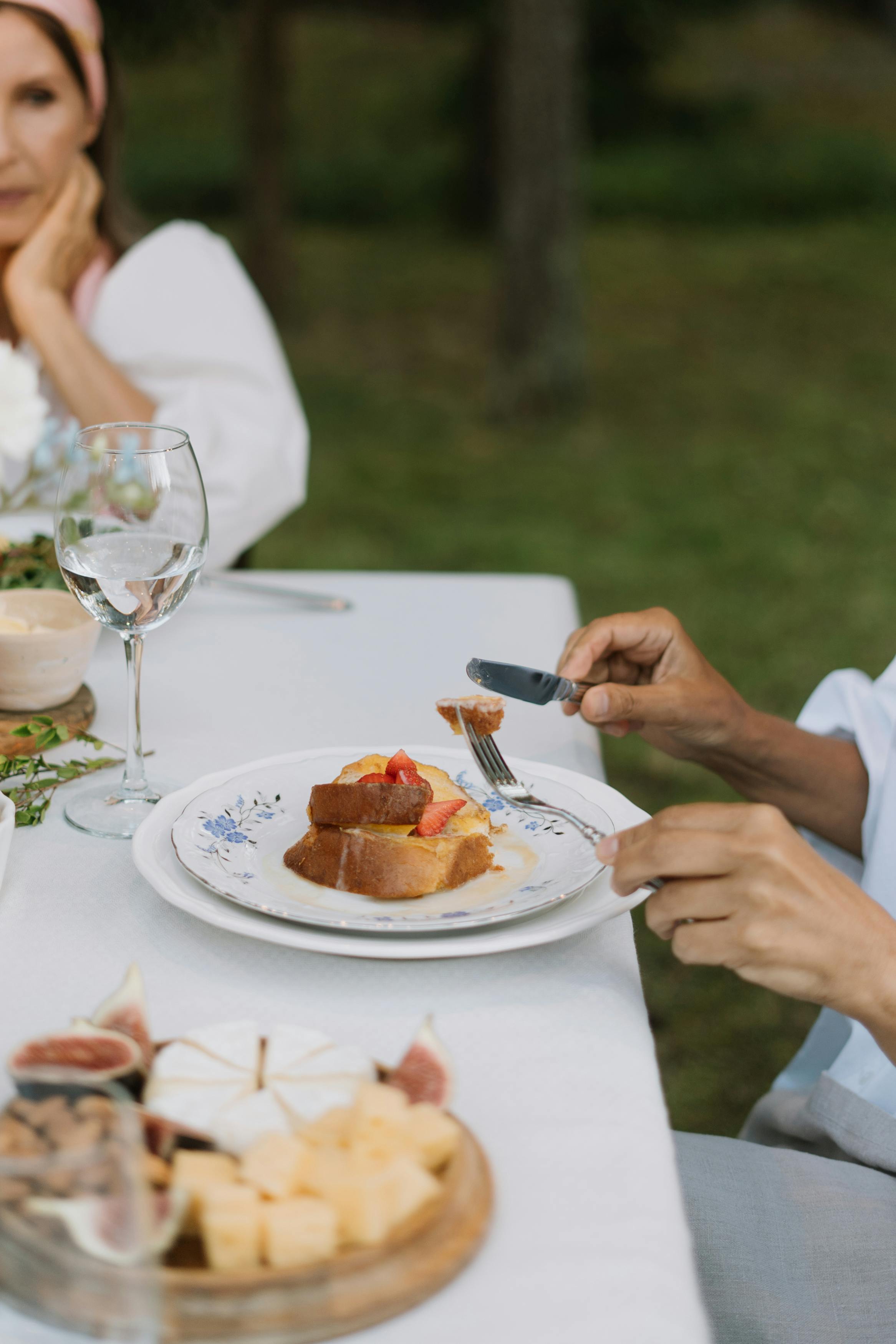 Person Holding Fork and Bread Knife · Free Stock Photo