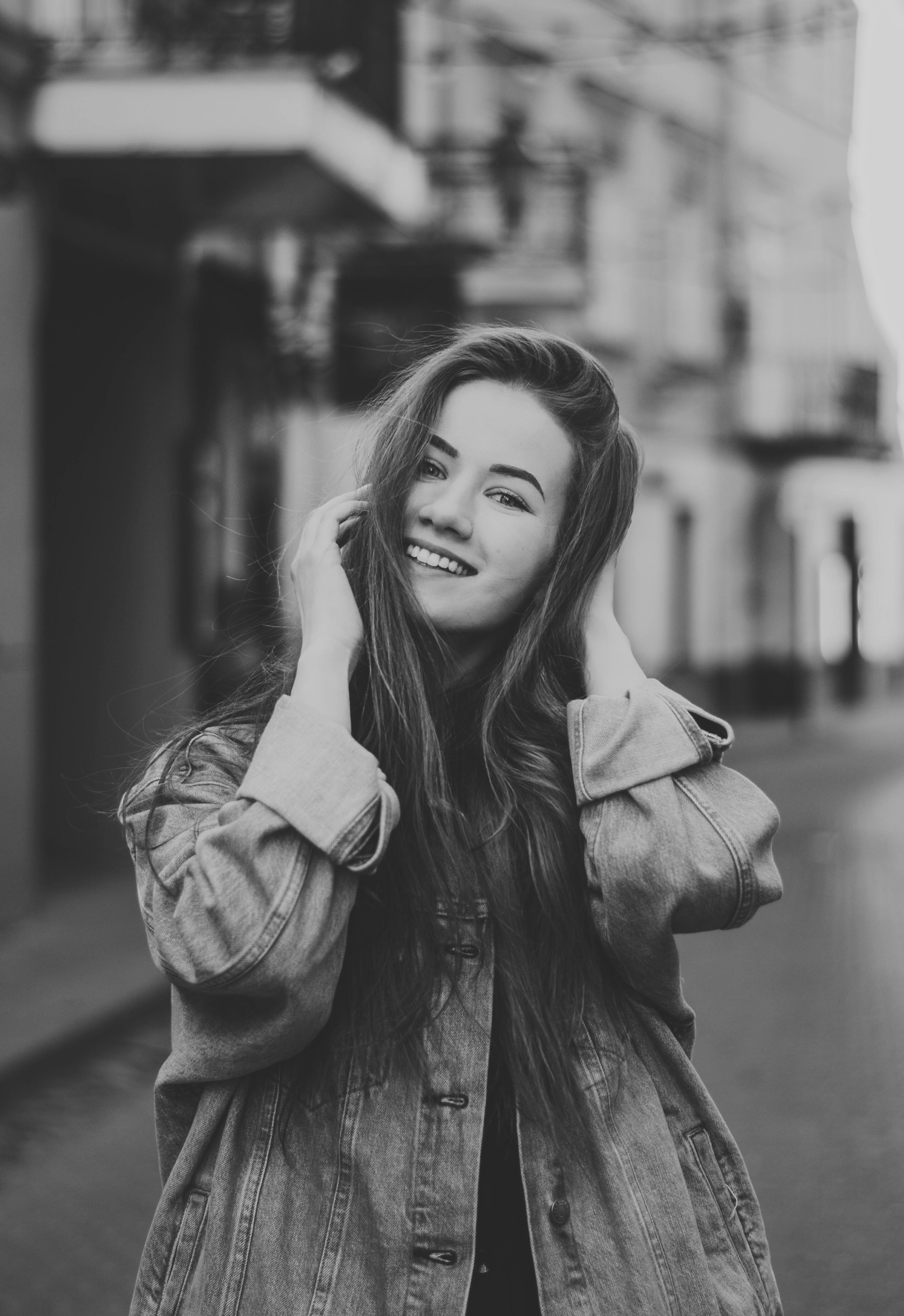 Woman Throwing Her Head Back and Smiling · Free Stock Photo