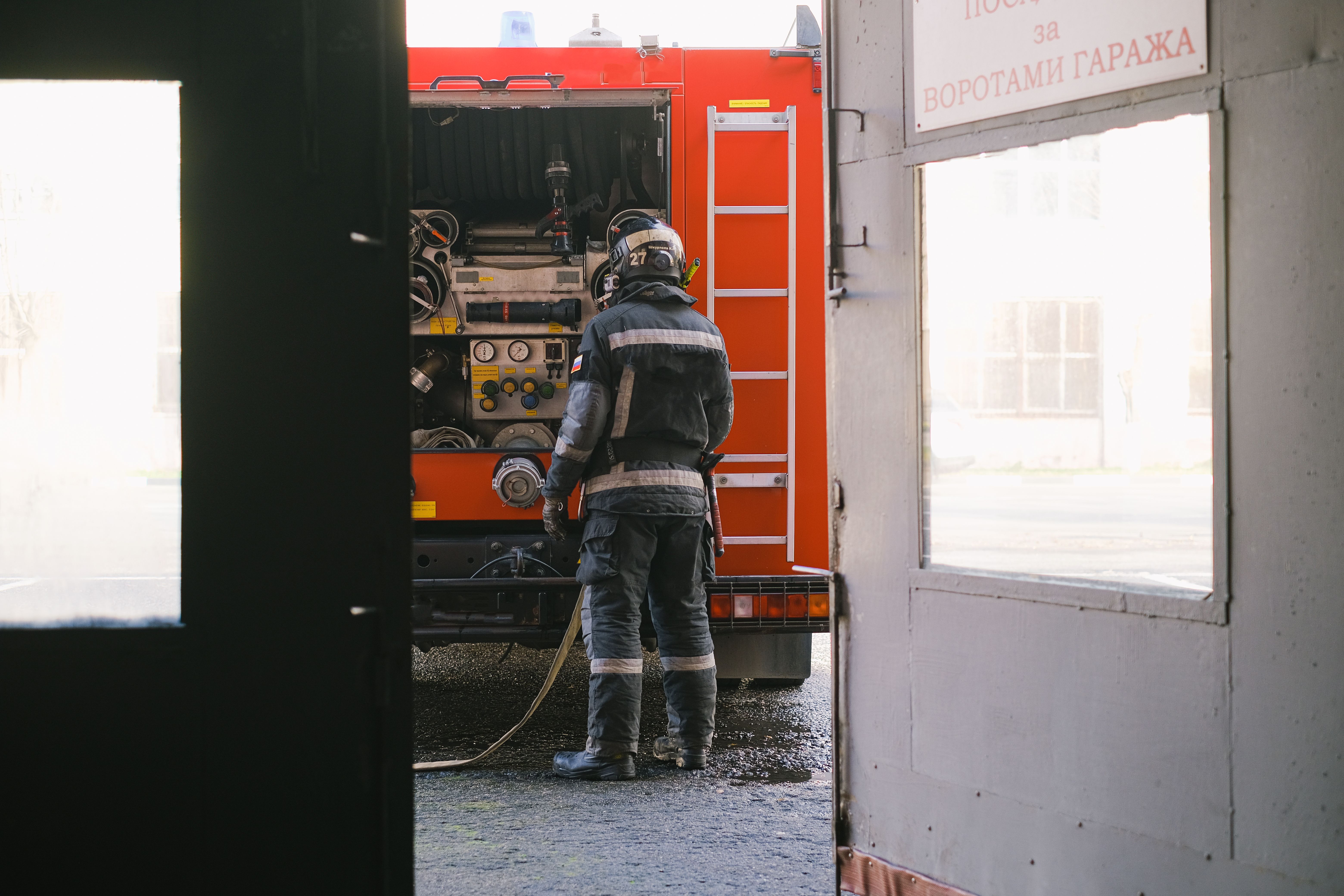A Firefighter Cutting a Tree With a Chainsaw · Free Stock Photo