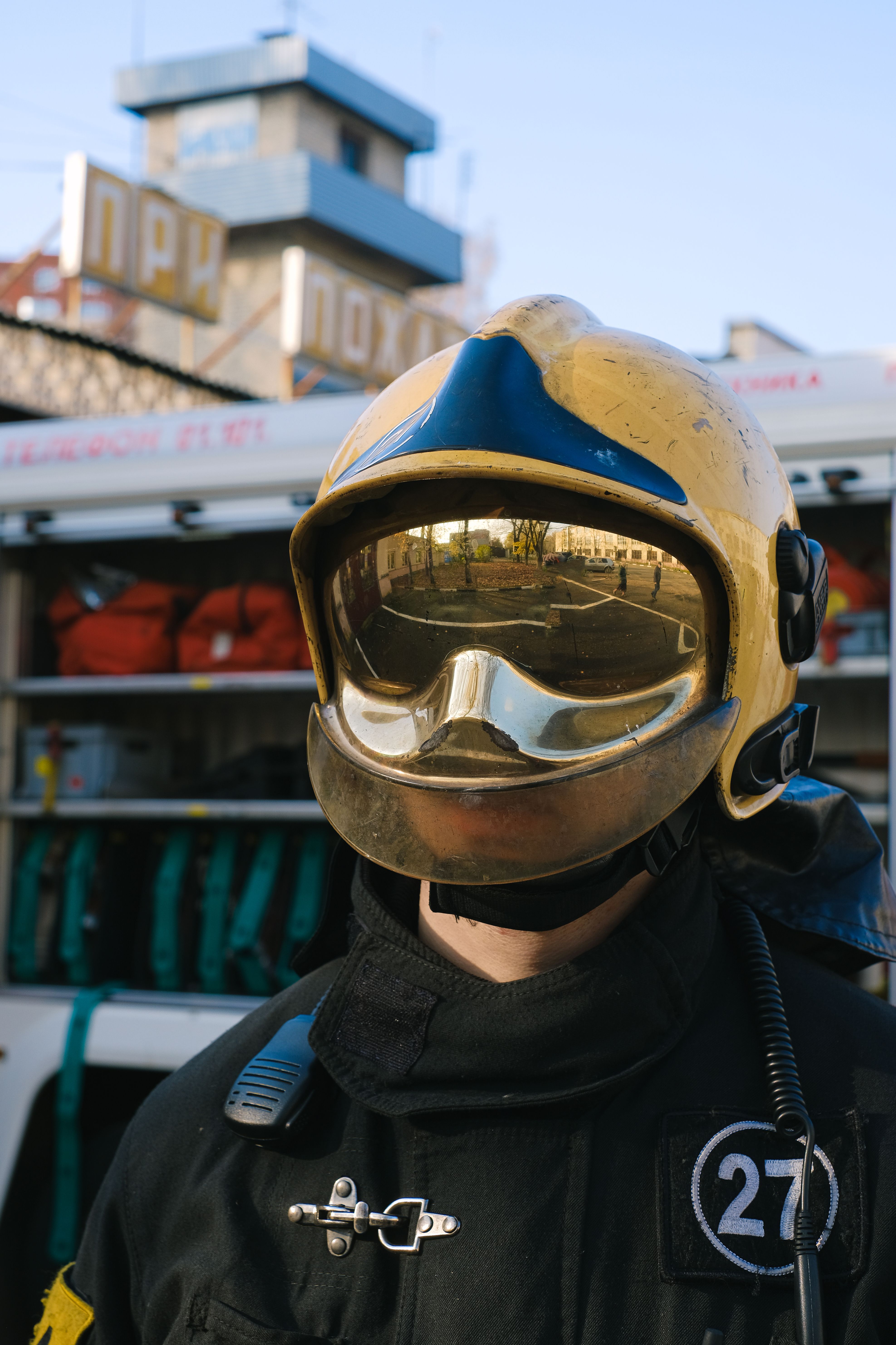 Yellow Hard Hat on Brown and Yellow Fireman's Suit · Free Stock Photo