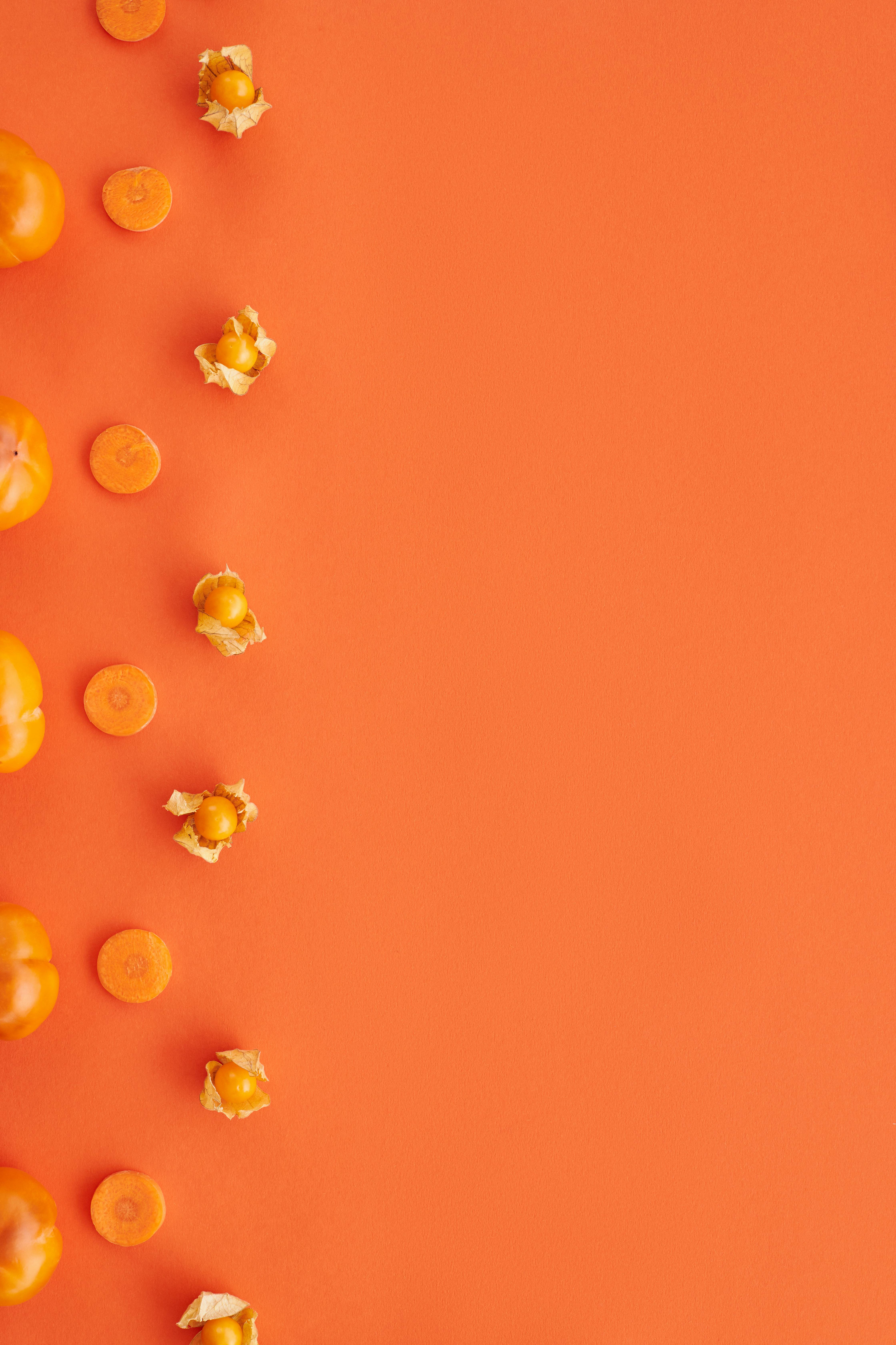 Close-Up Shot of Orange Fruits and Vegetables on an Orange Surface ...