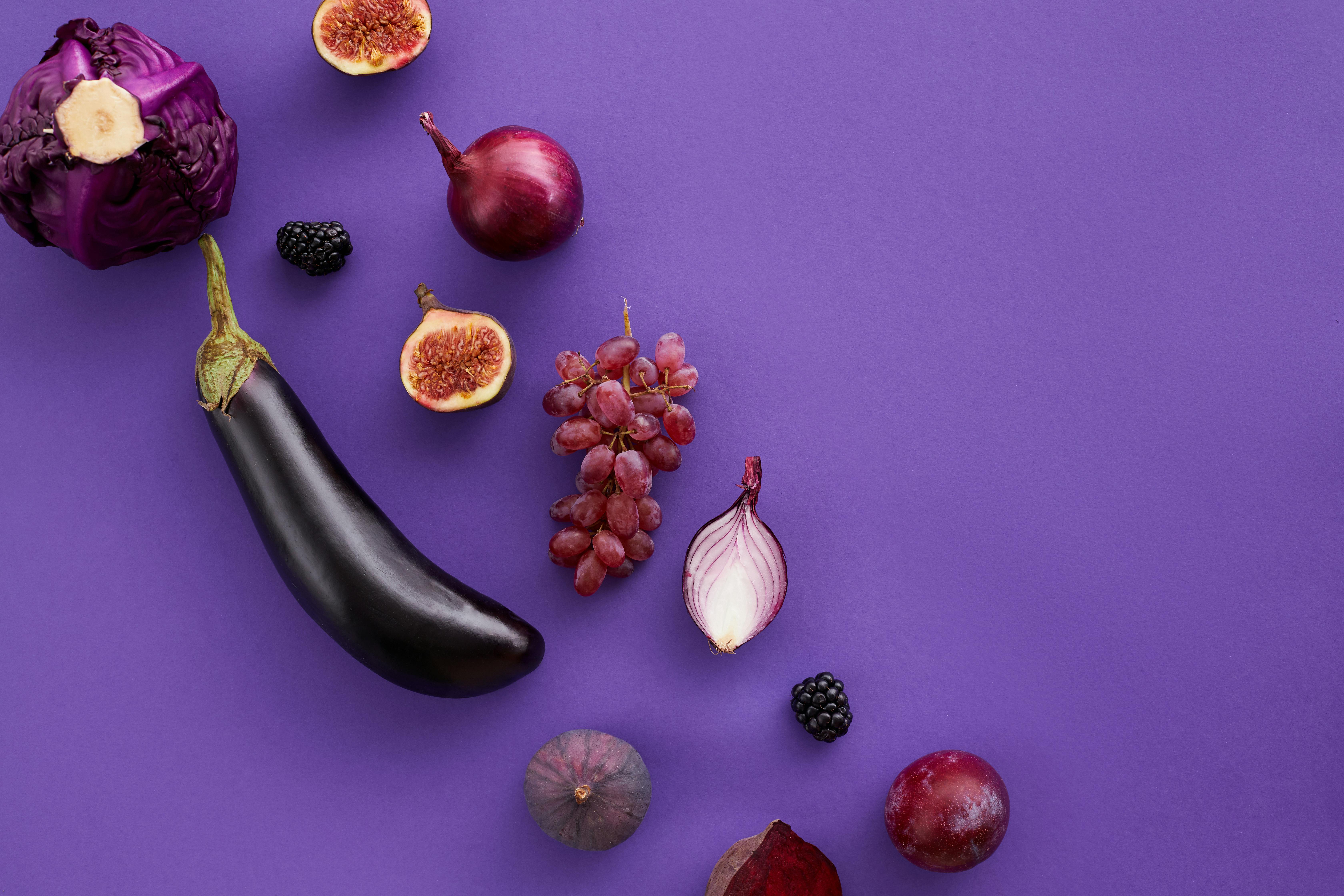 Close-Up Shot of Purple Fruits and Vegetables on a Purple Surface ...