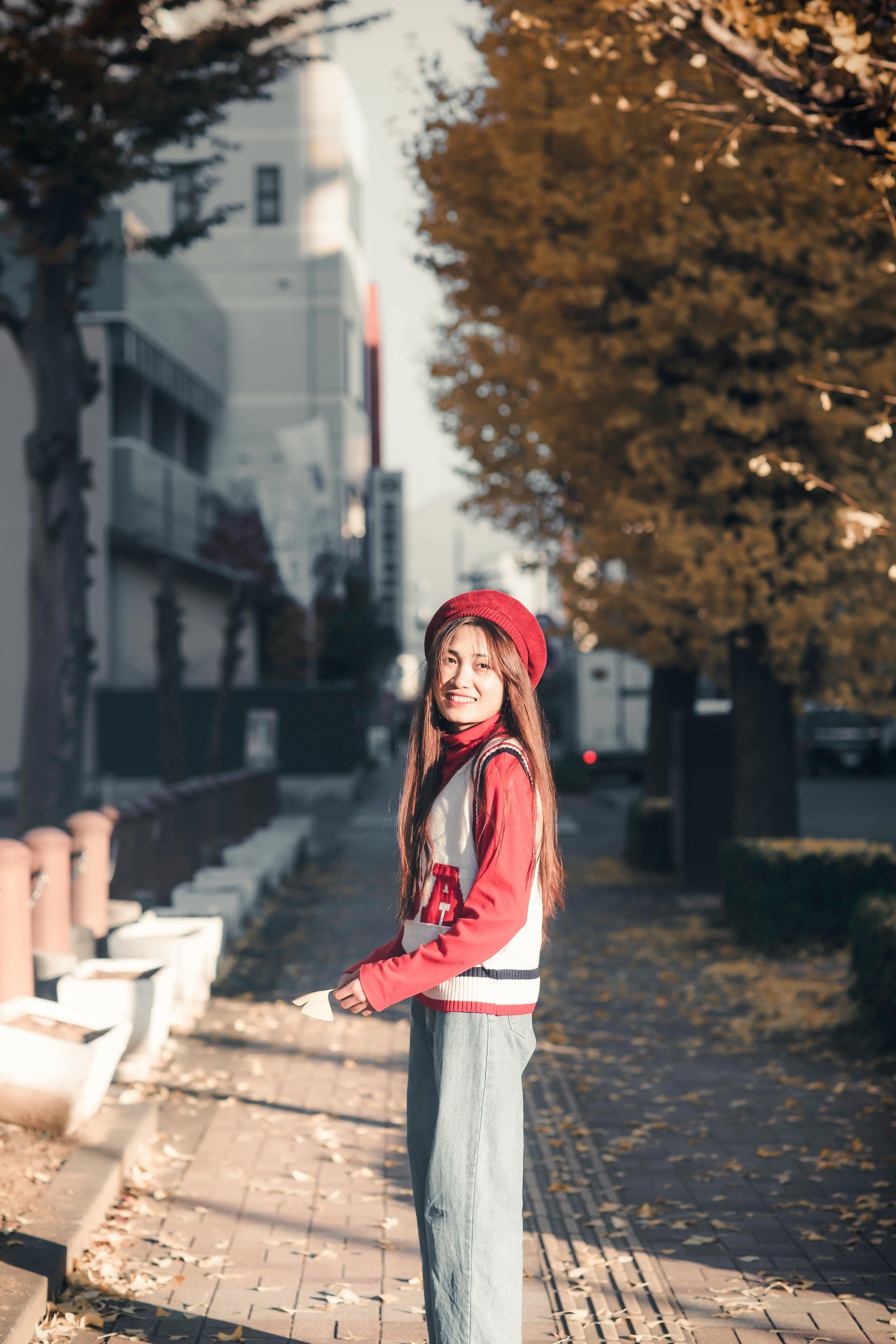 A Woman Catching Falling Leaves · Free Stock Photo