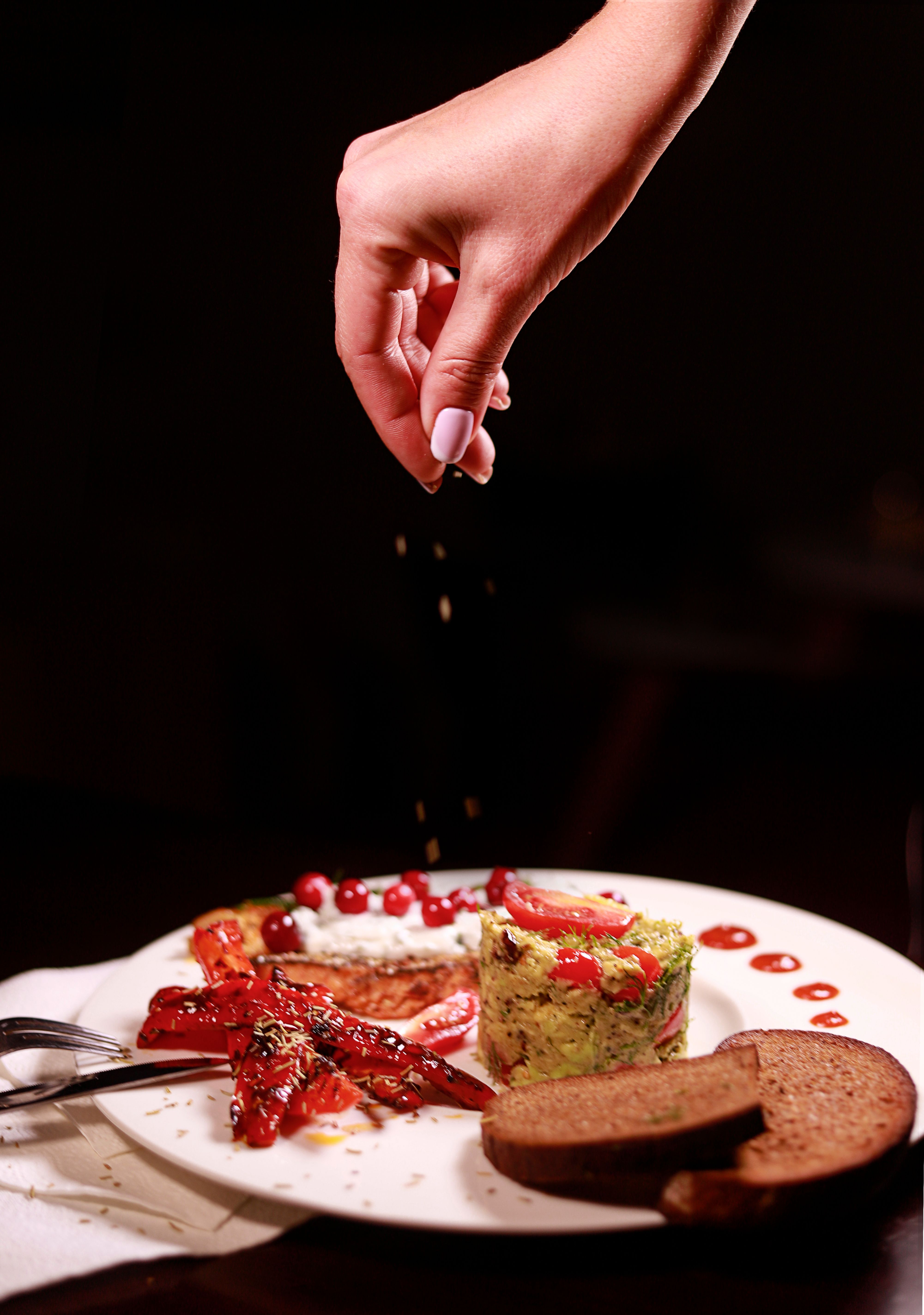 Person Seasoning Food on Plate · Free Stock Photo