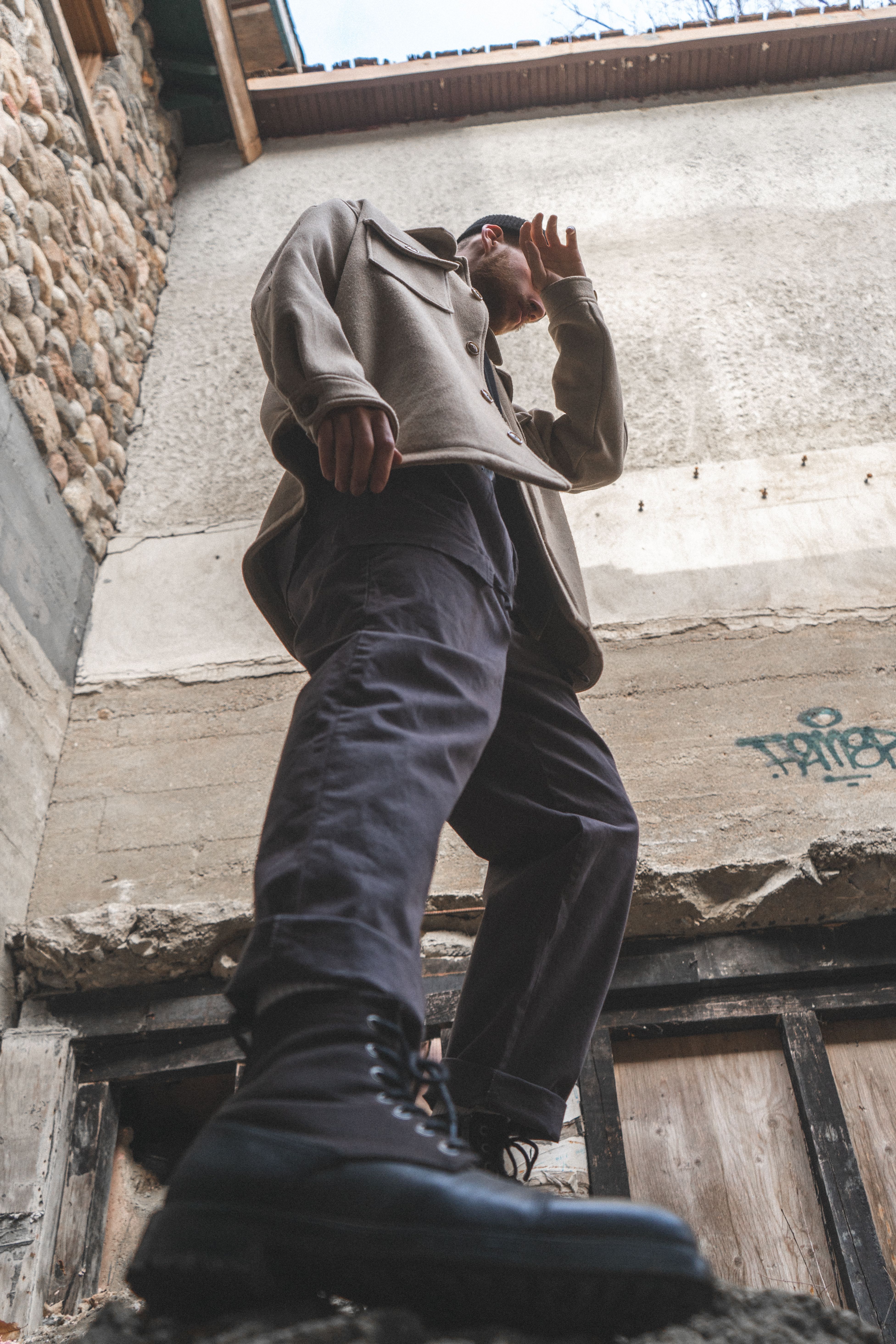 Low Angle Shot of a Man Wearing Coat · Free Stock Photo