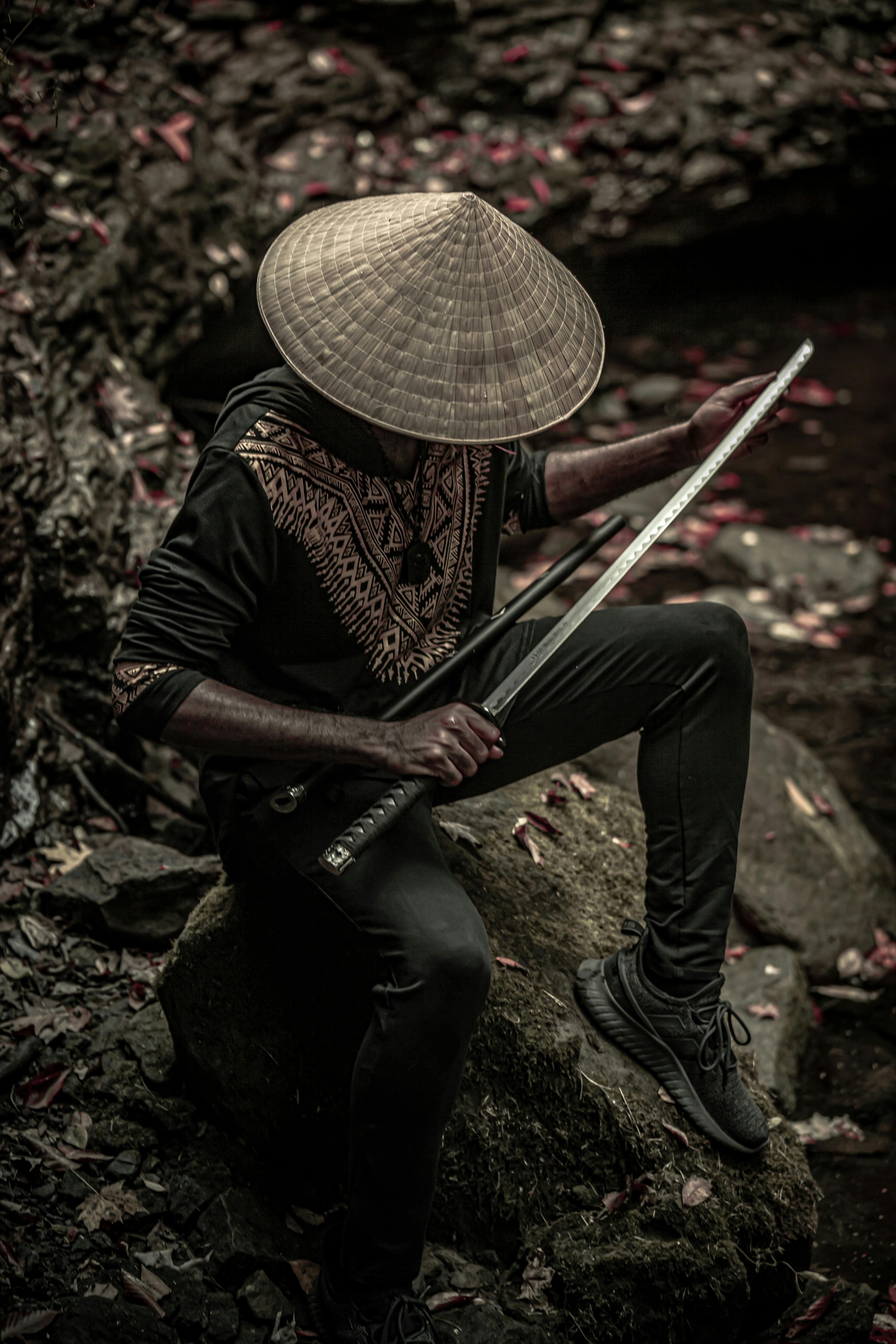 A Man Holding a Samurai · Free Stock Photo
