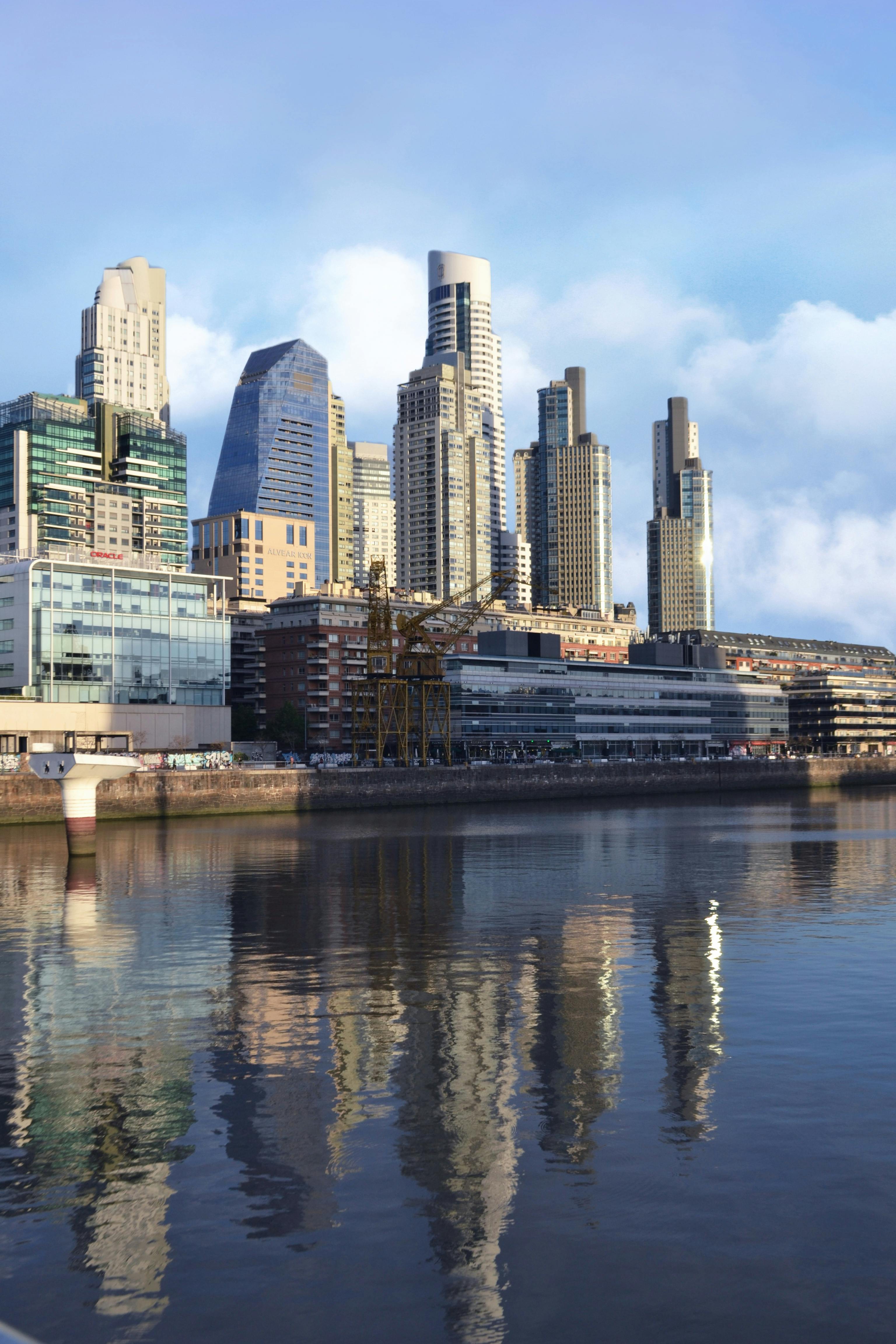Skyscrapers Reflecting in River · Free Stock Photo