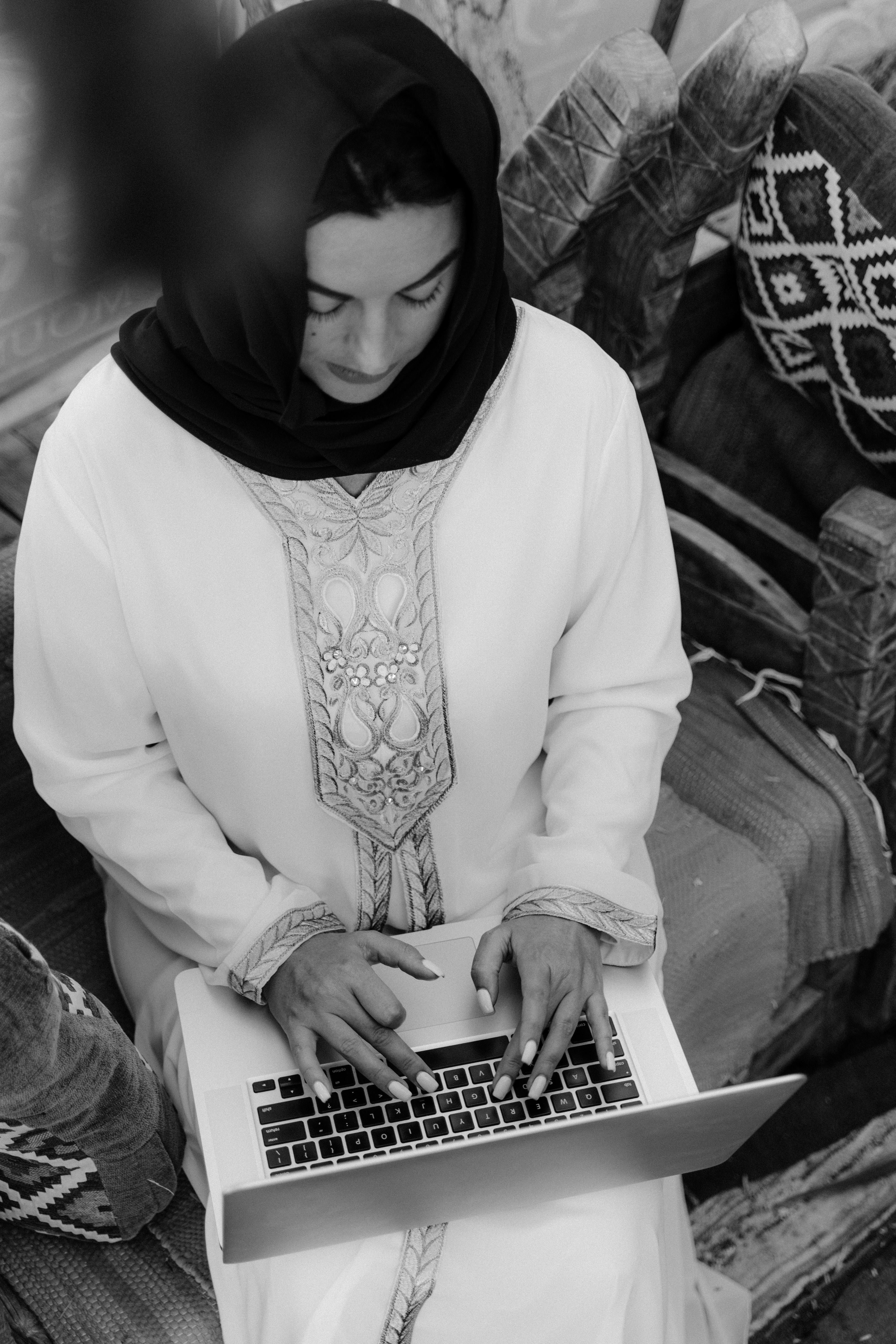 Woman Wearing Hijab Using a Laptop · Free Stock Photo