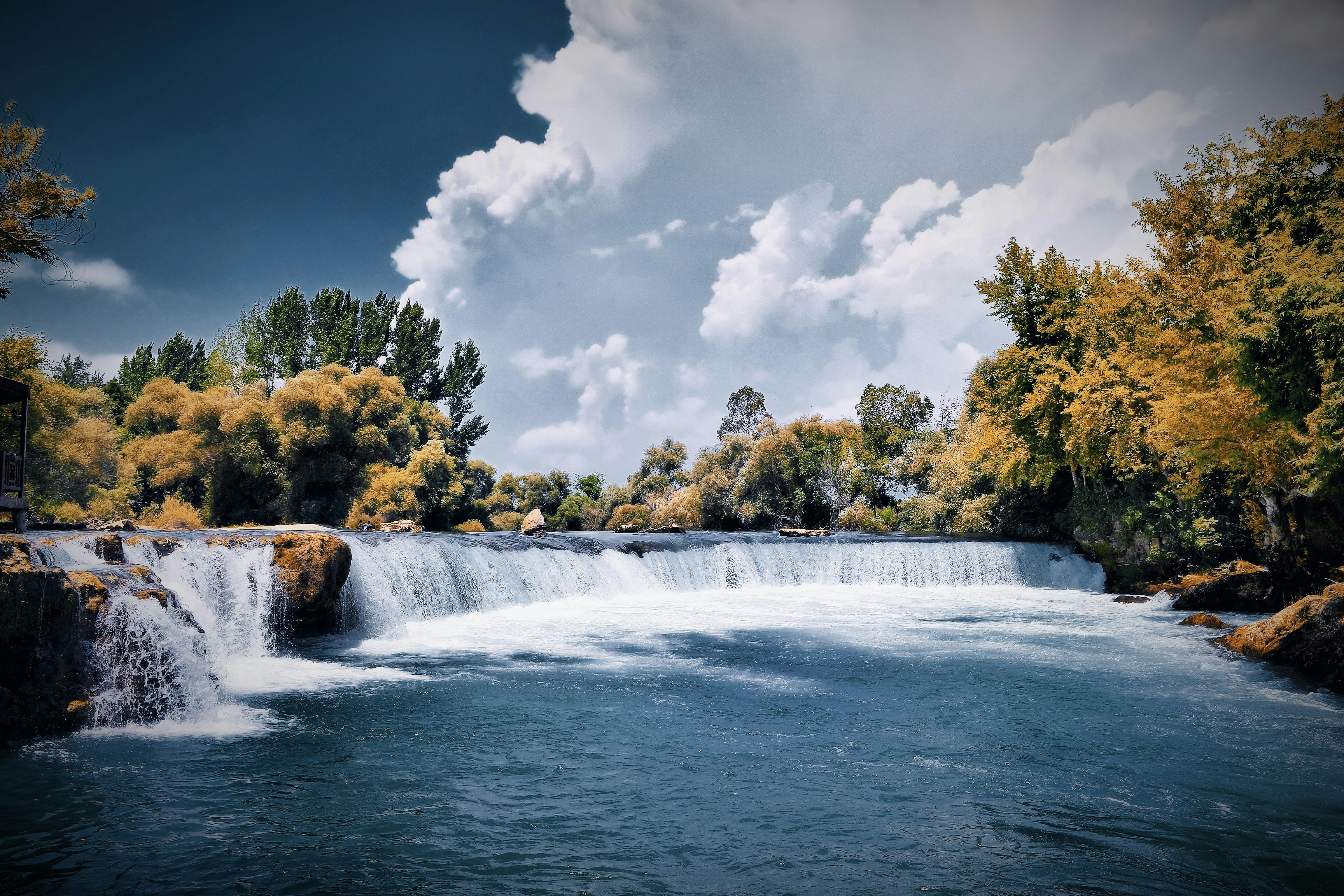 Photo of Waterfalls Under Cloudy Sky · Free Stock Photo