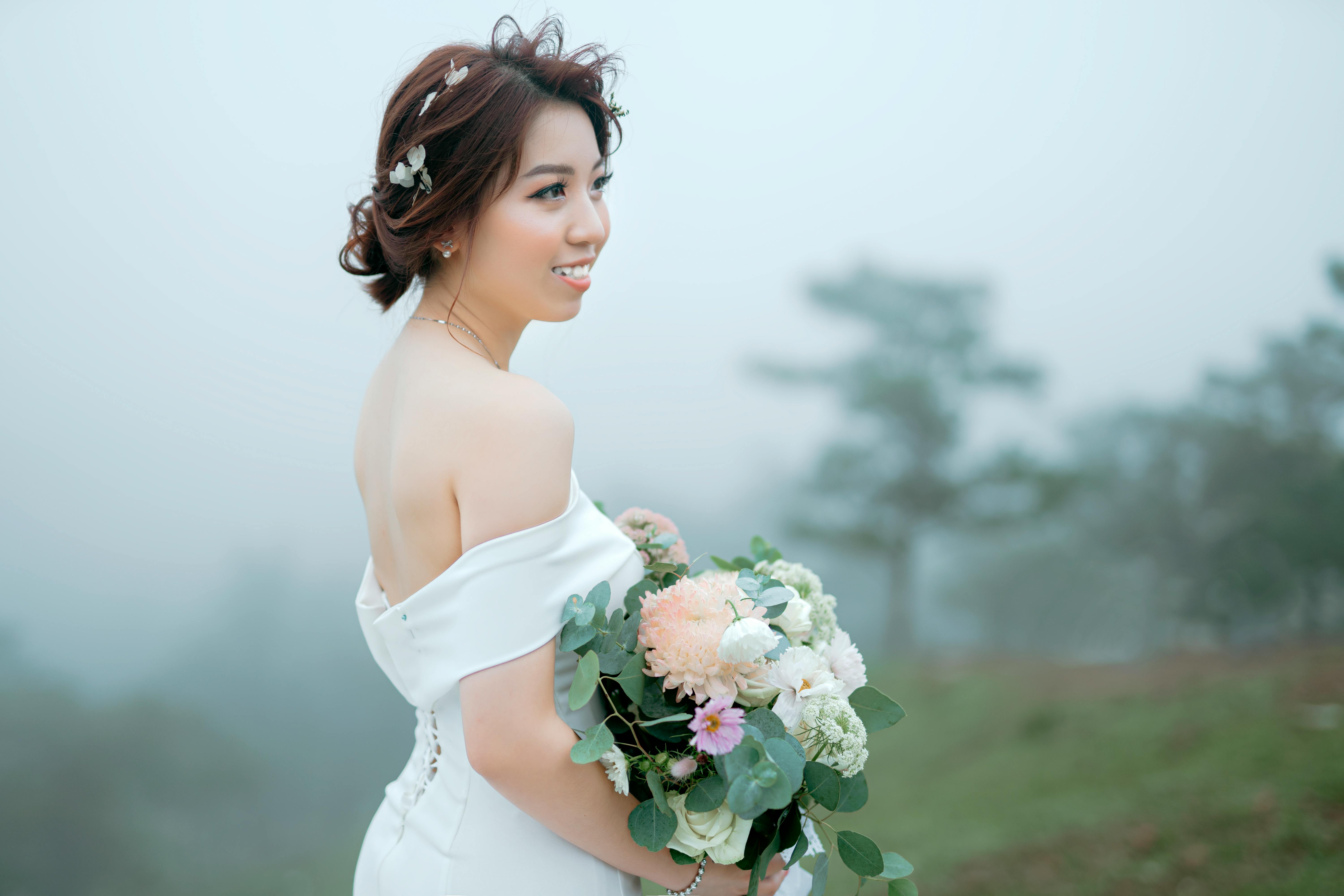 Happy Asian bride in nature · Free Stock Photo