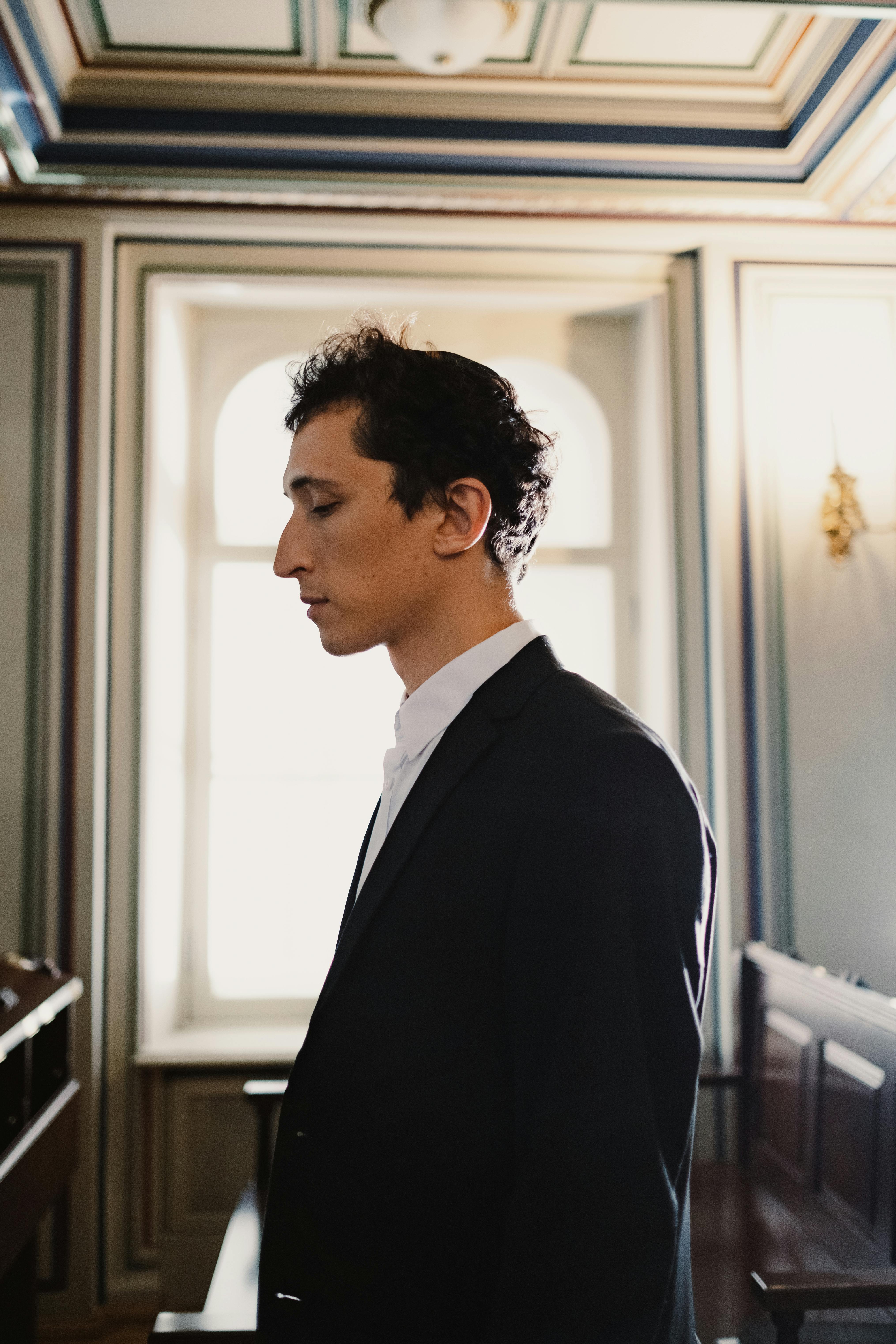 Side View of Man on Black Suit · Free Stock Photo