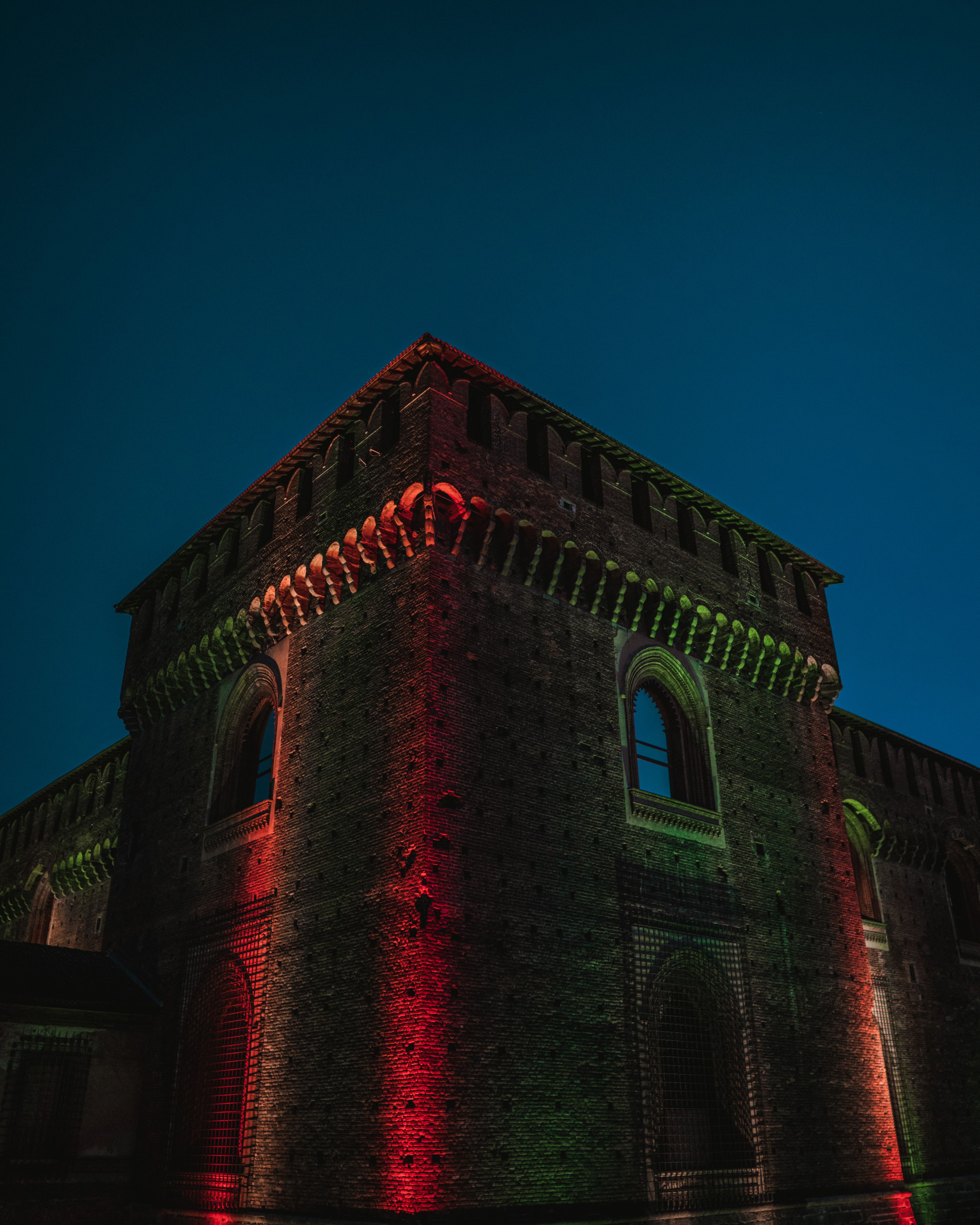 Brown Brick Building during Night Time · Free Stock Photo