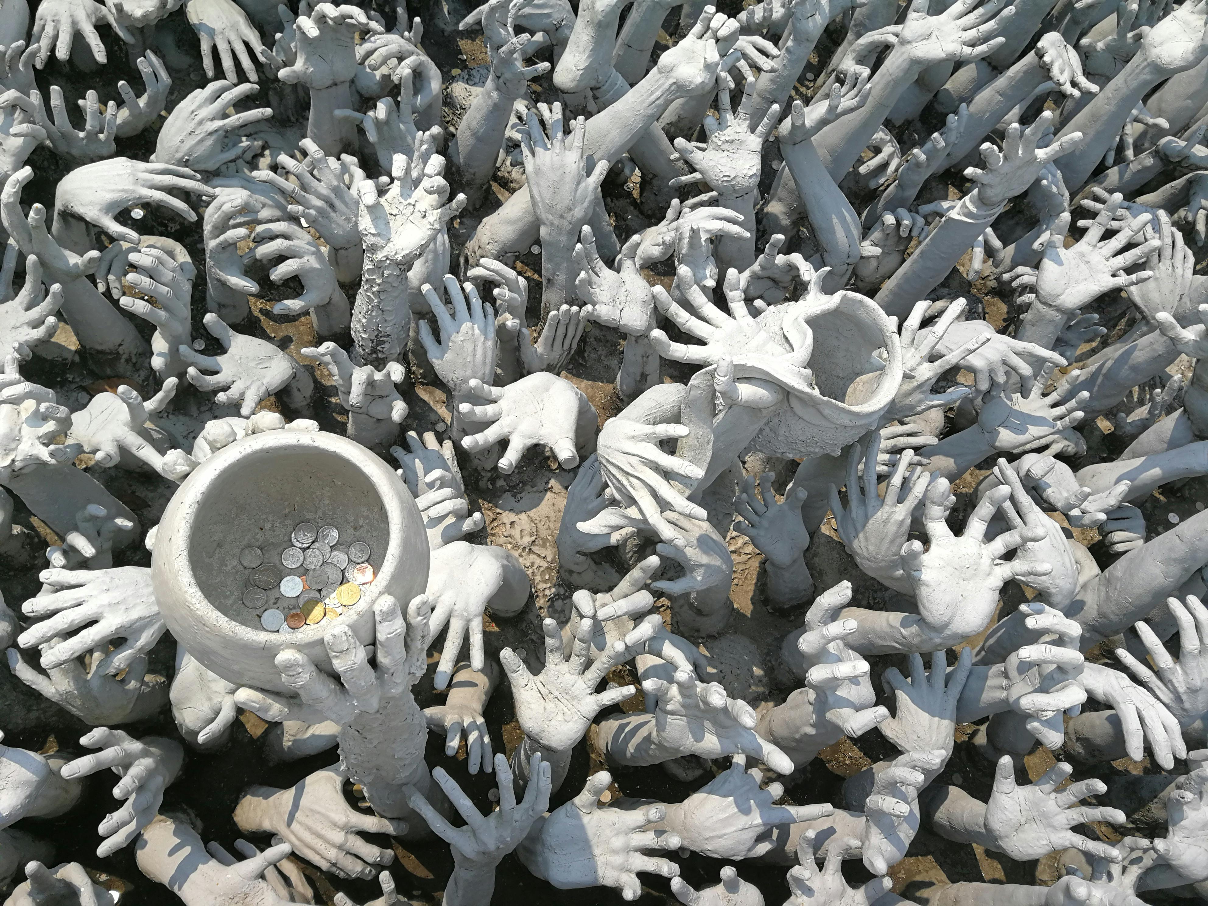 Sculptures of Arms and Hands Reached Out · Free Stock Photo
