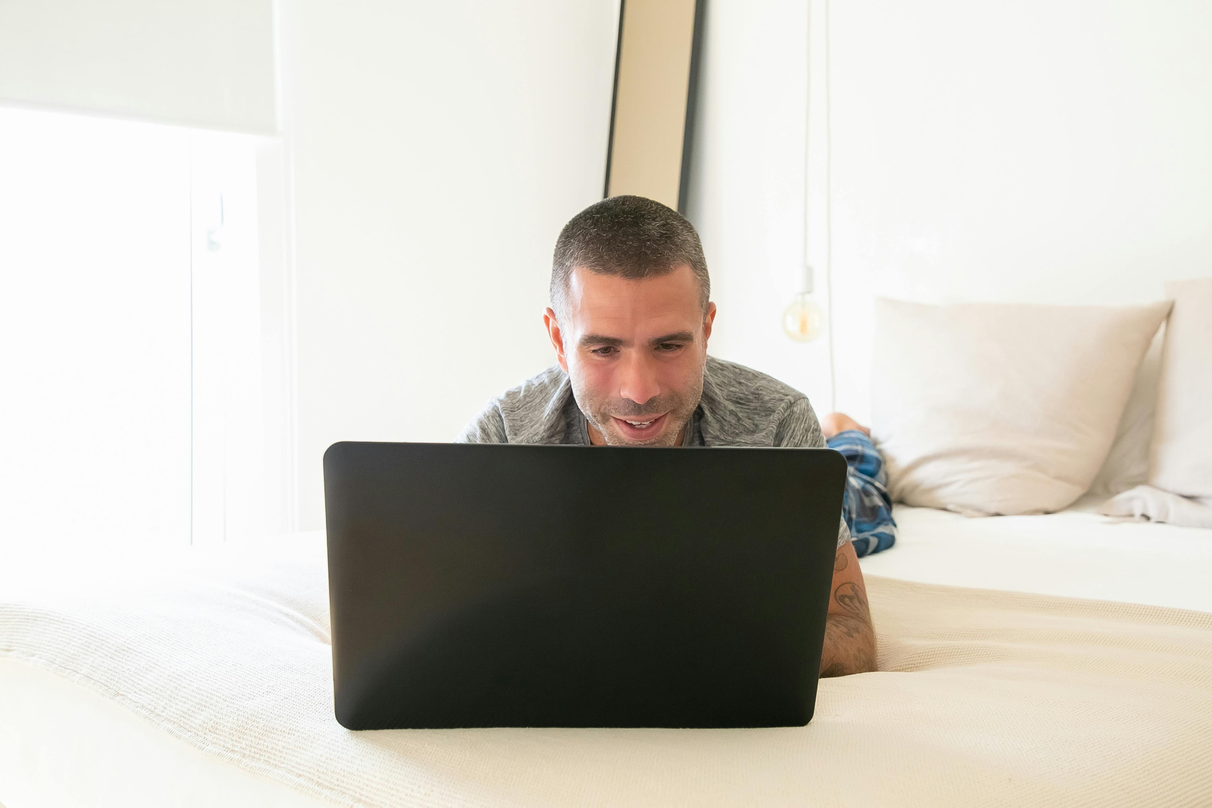 Close Up Photo of a Man Using Laptop · Free Stock Photo