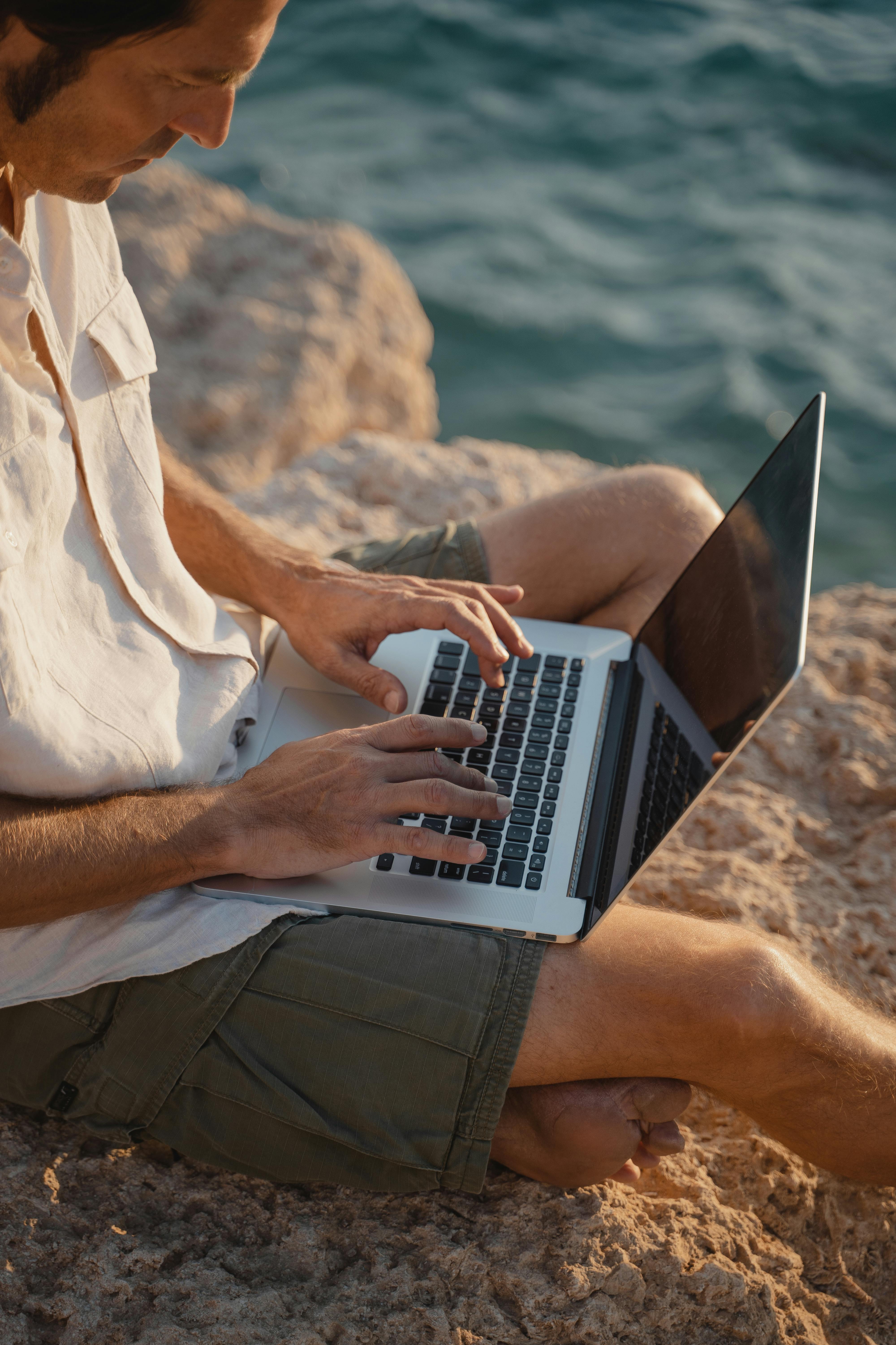 Person Typing on a Laptop · Free Stock Photo