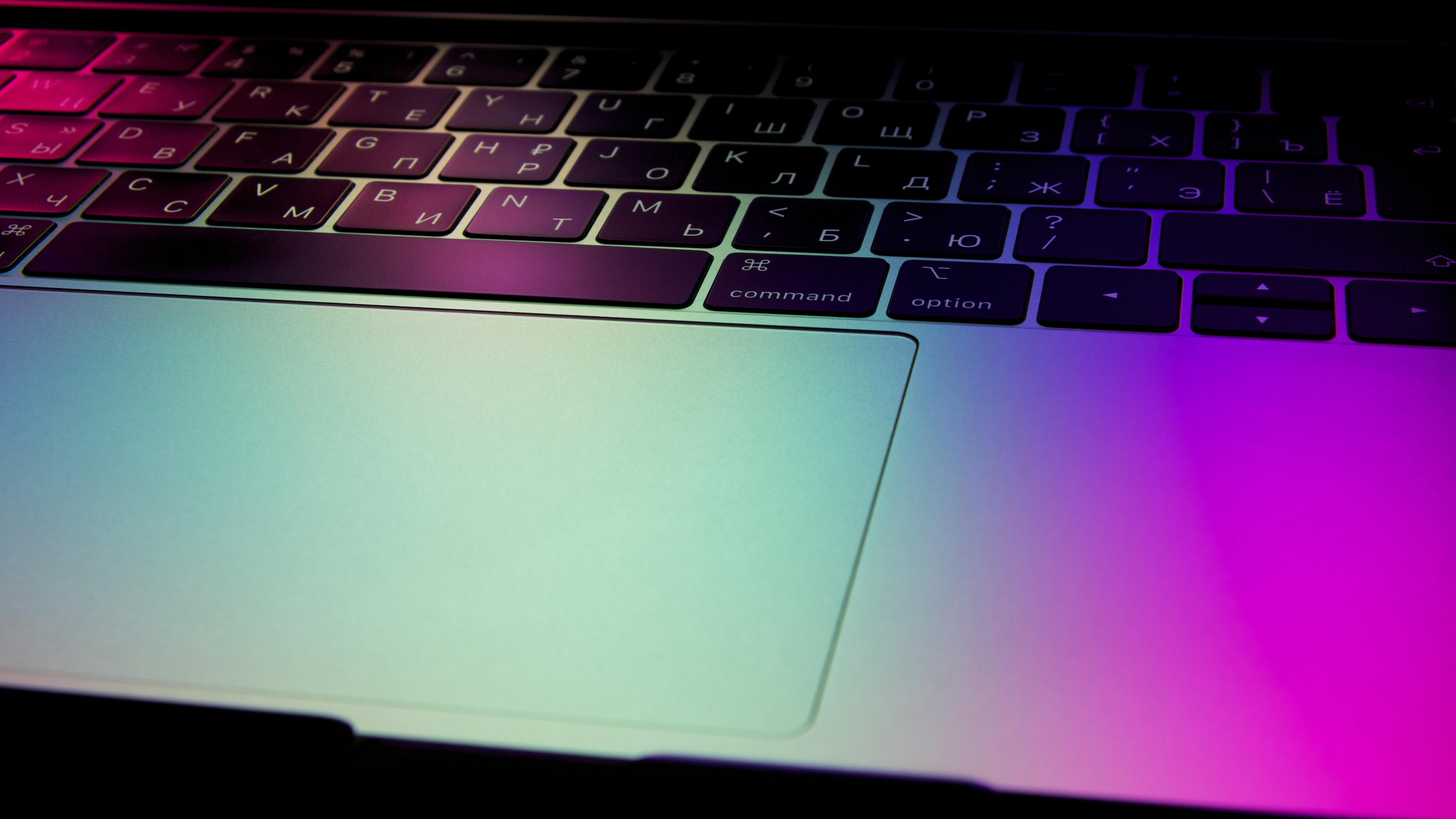 Close-up of a Laptop Touchpad and Keyboard in Purple Lighting · Free ...