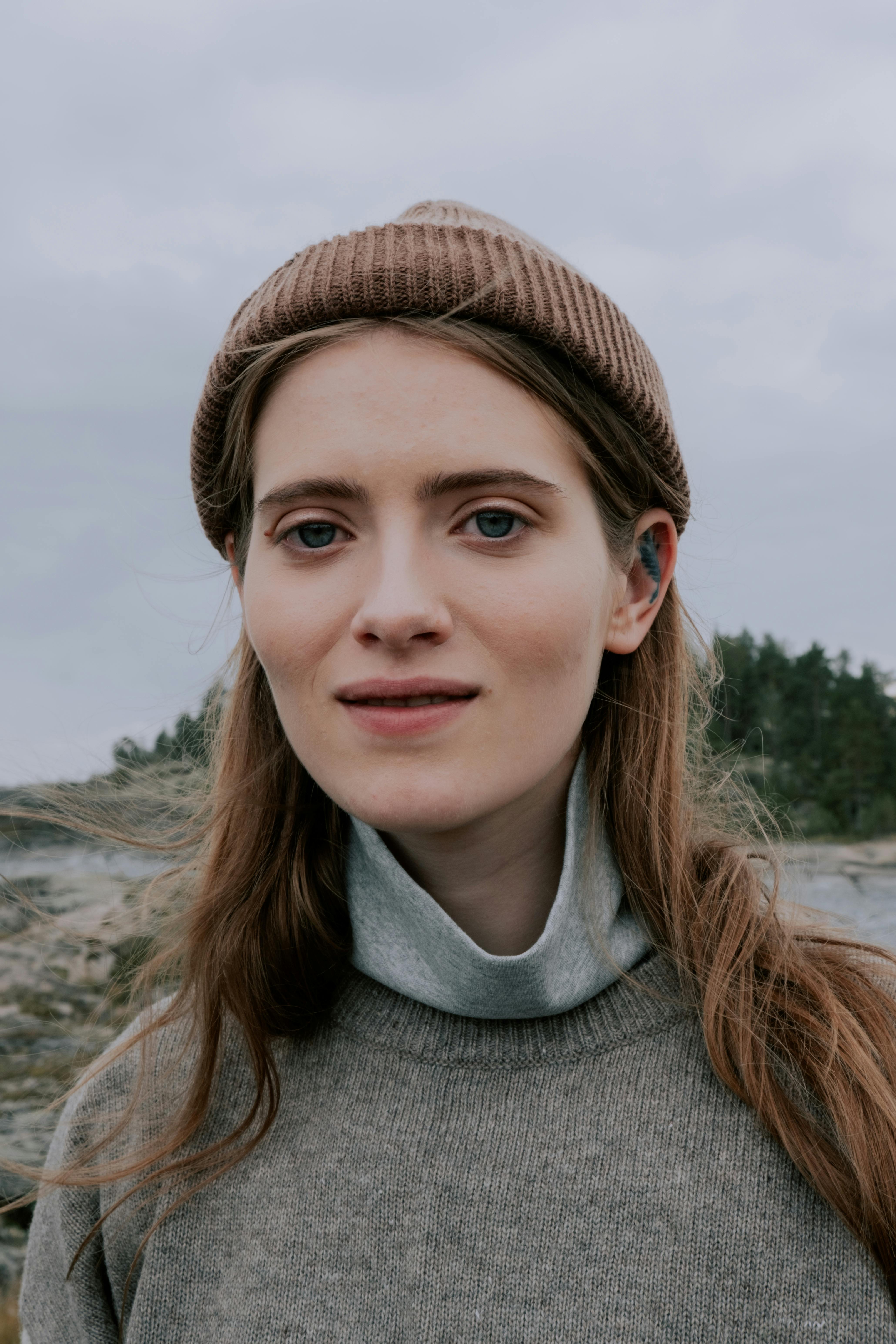 Portrait of a Woman Wearing a Knit Cap · Free Stock Photo