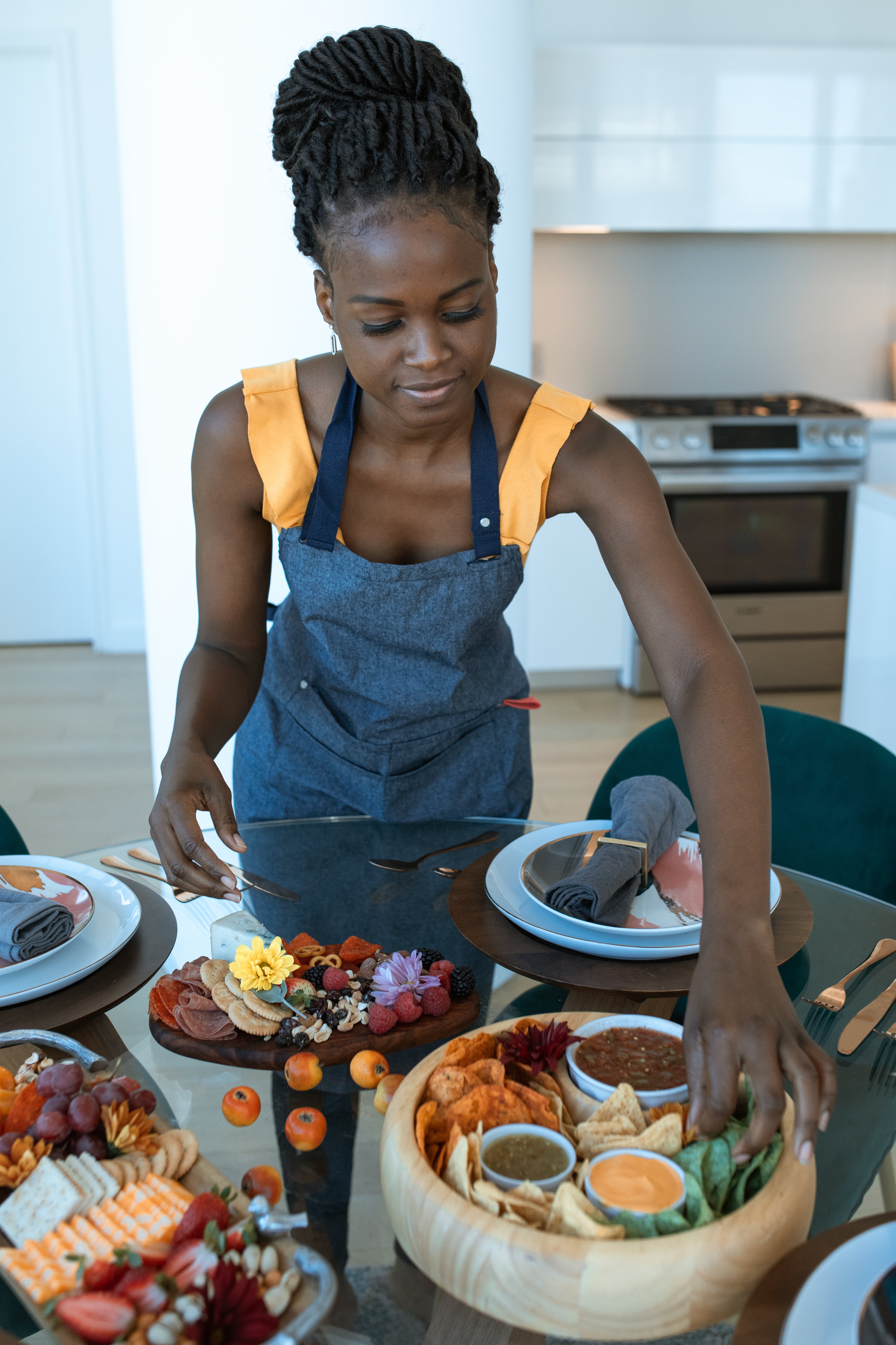 A Woman Standing at the Table · Free Stock Photo