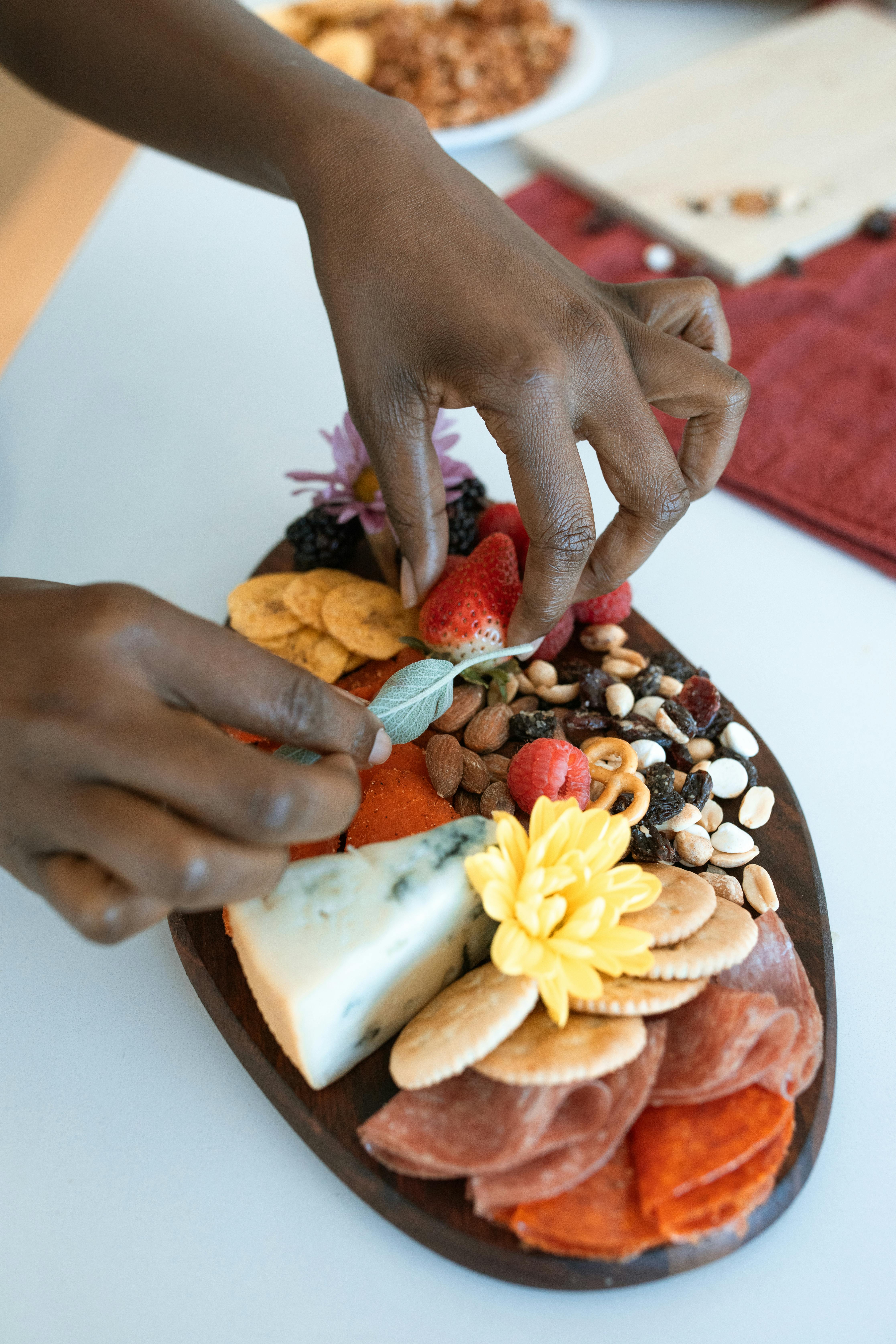 A Person Preparing a Food Platter · Free Stock Photo