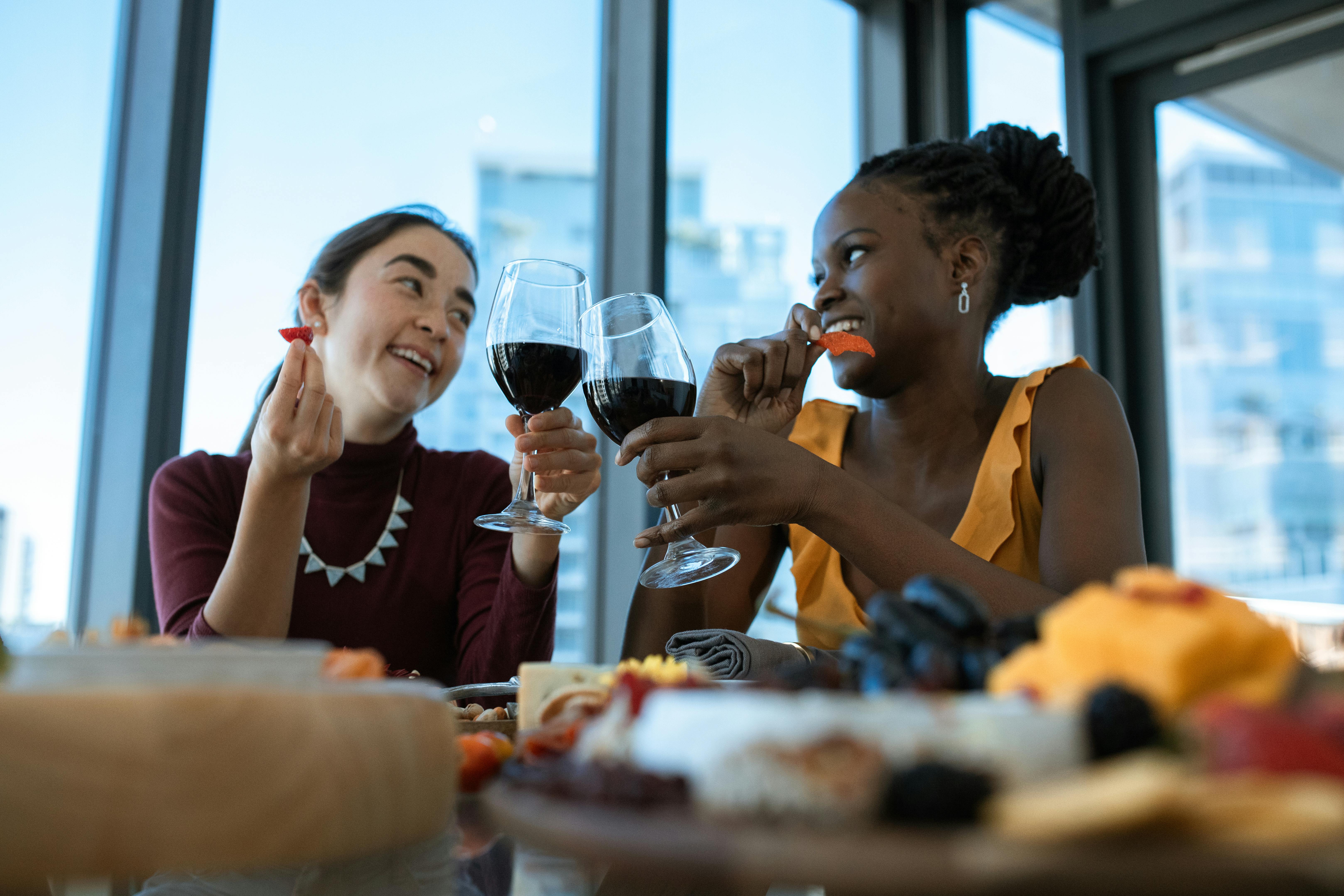Friends Having a Toast while Having a Conversation · Free Stock Photo
