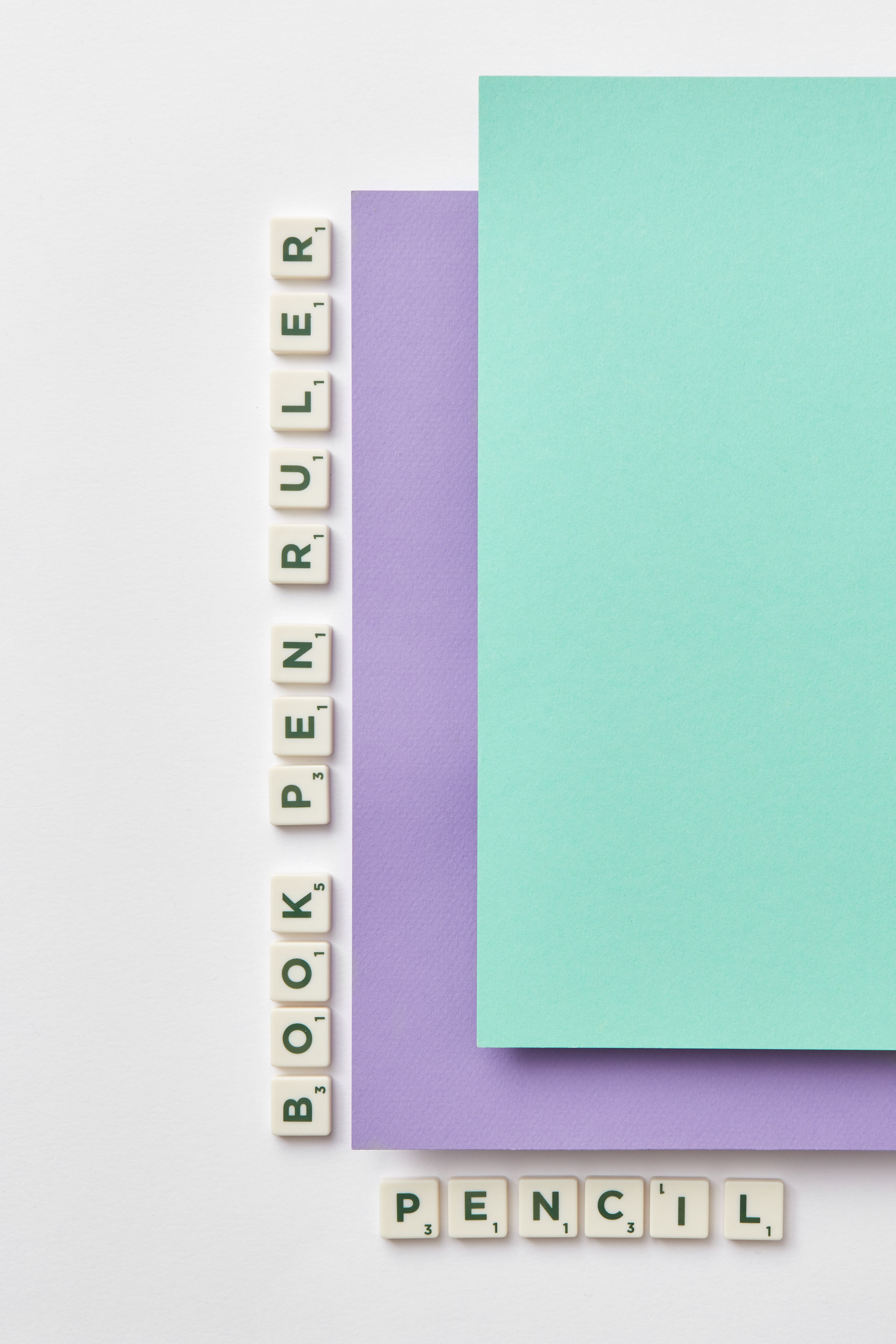 Sheets of Paper and Scrabble Tiles · Free Stock Photo