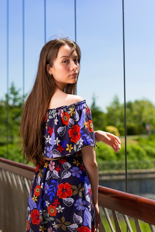 Woman In Blue Off Shoulder Dress Standing Beside The Railings · Free