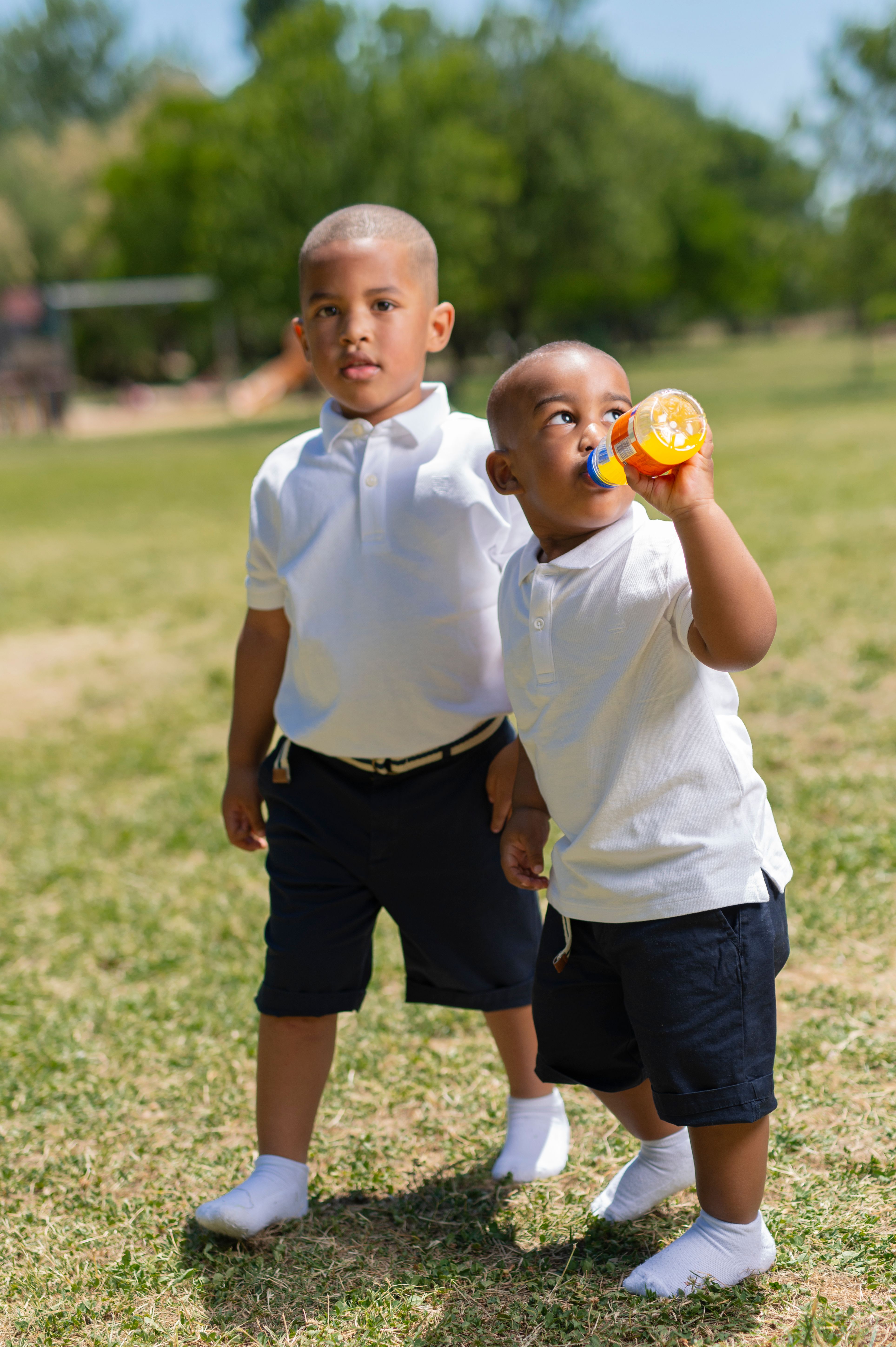 Boys in White Polo Shirts · Free Stock Photo