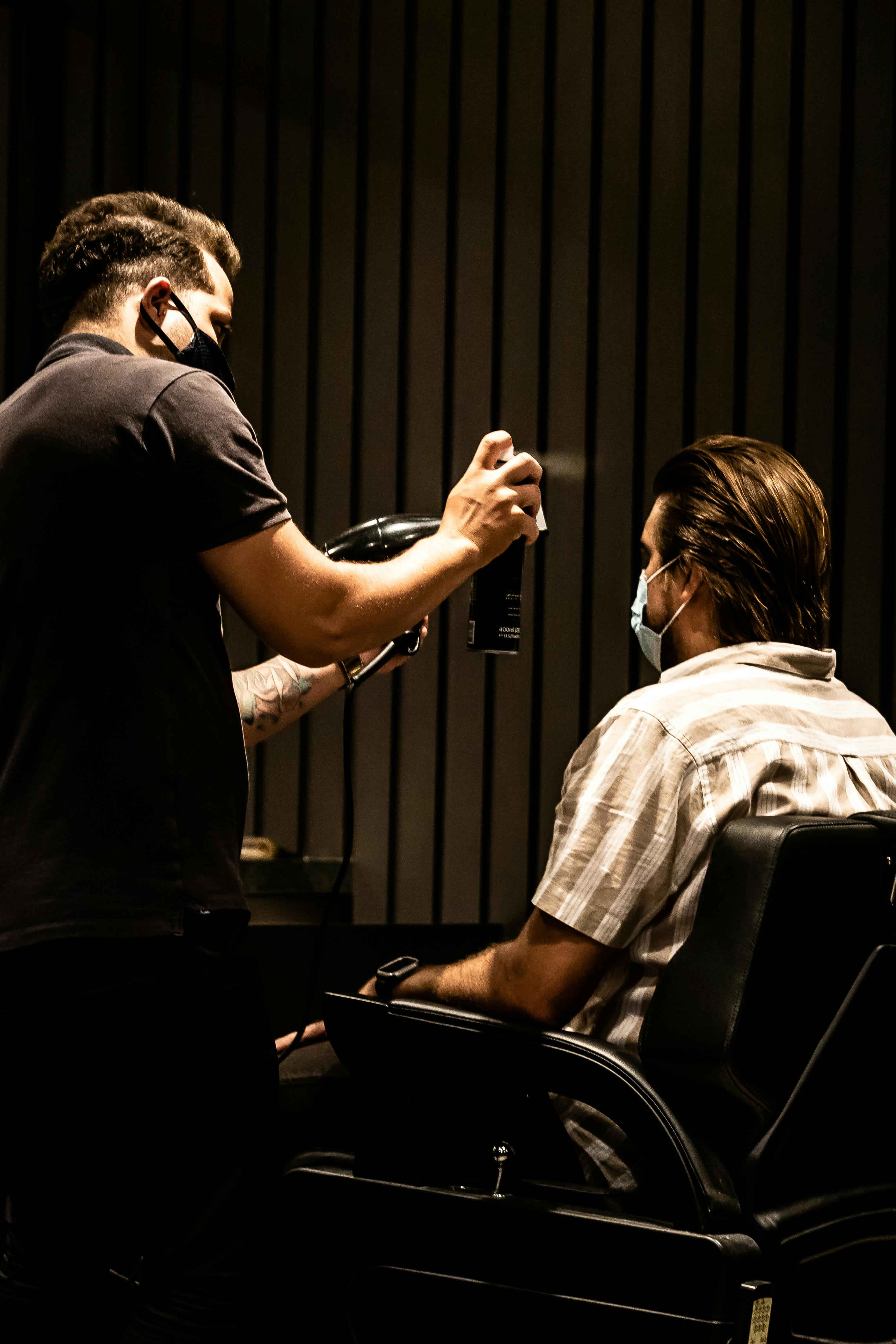 Barber Working on a Client · Free Stock Photo