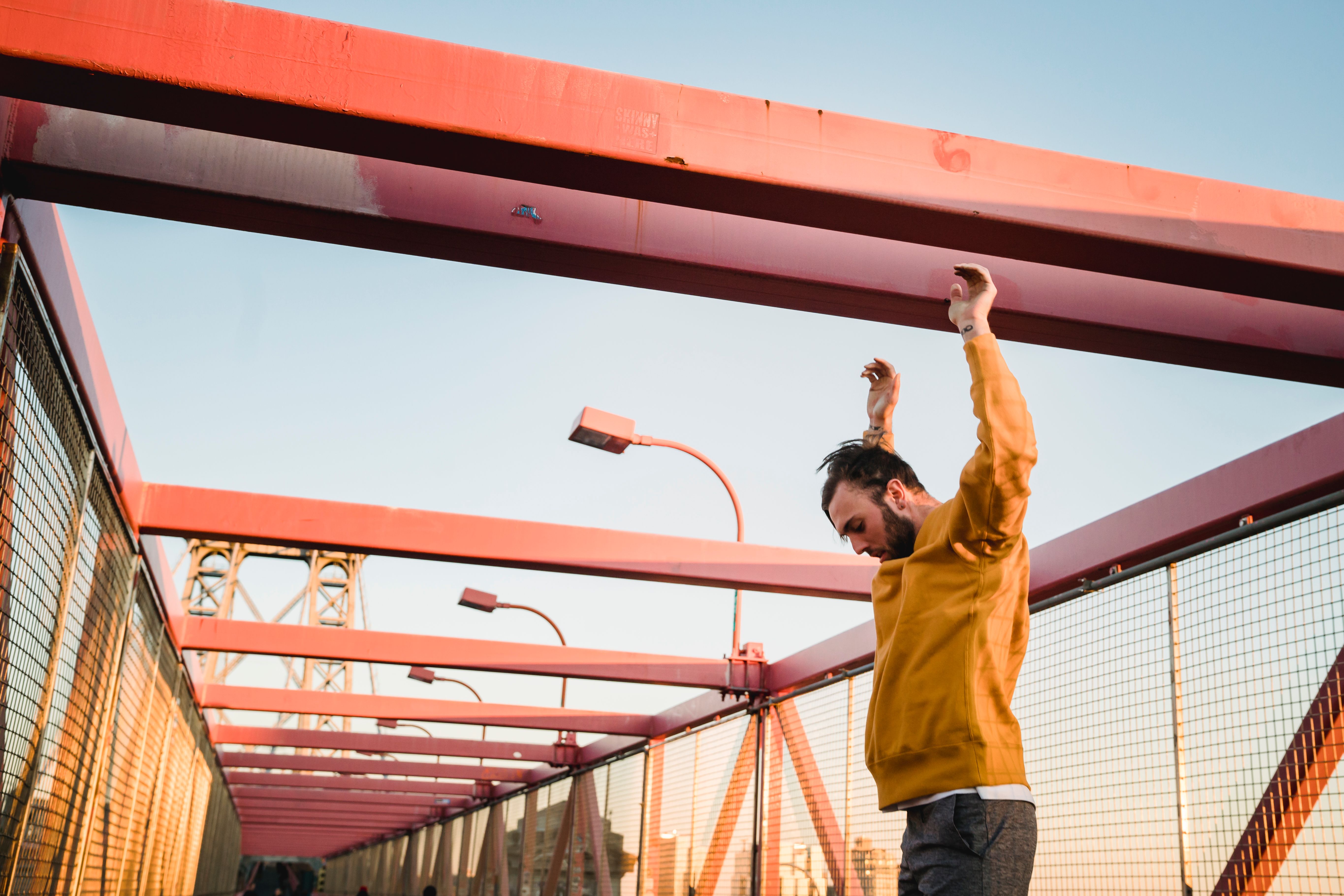 Active man jumping on bridge · Free Stock Photo