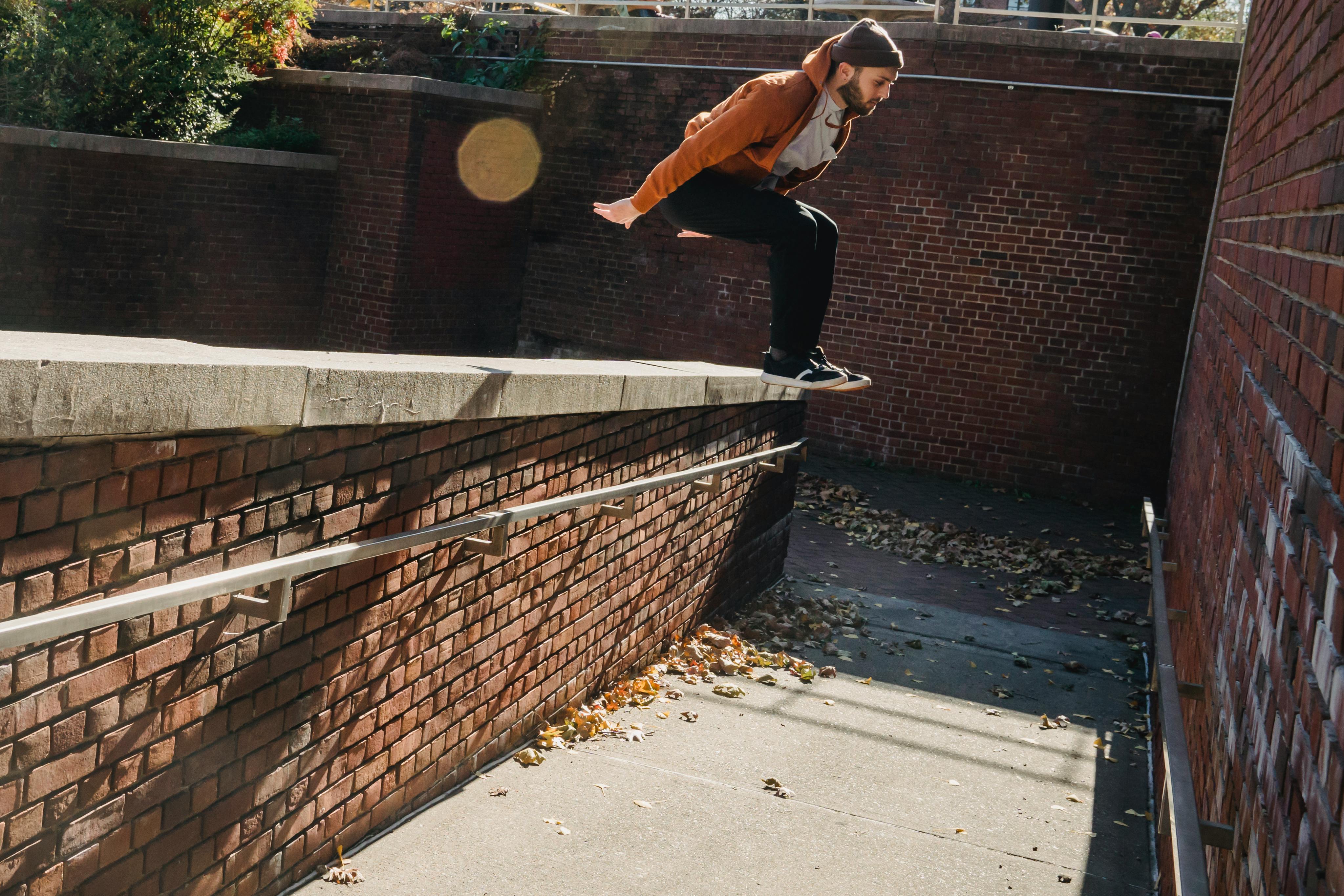 Strong man jumping over railing · Free Stock Photo