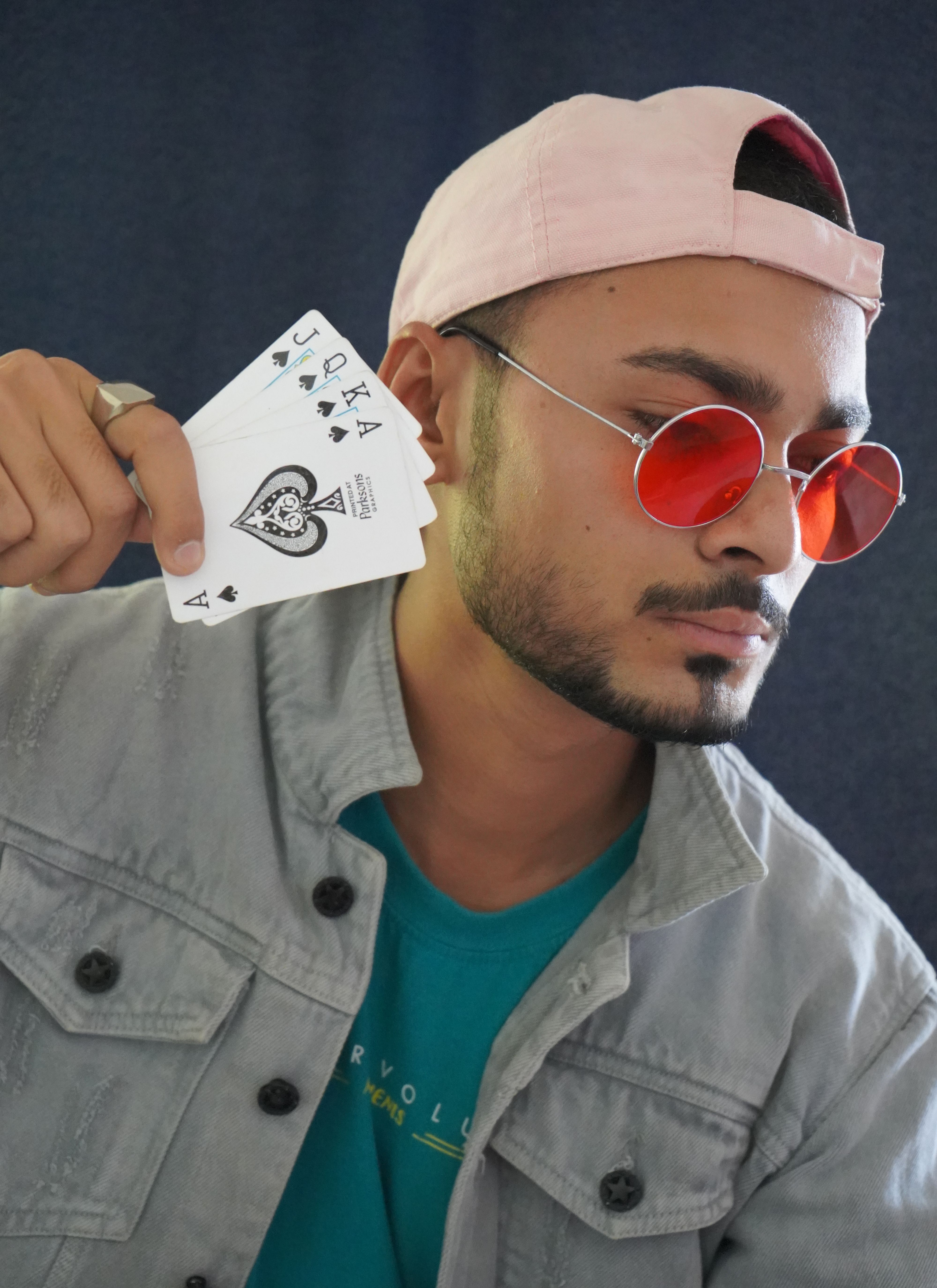 A Man in Gray Jacket Holding a Playing Cards · Free Stock Photo