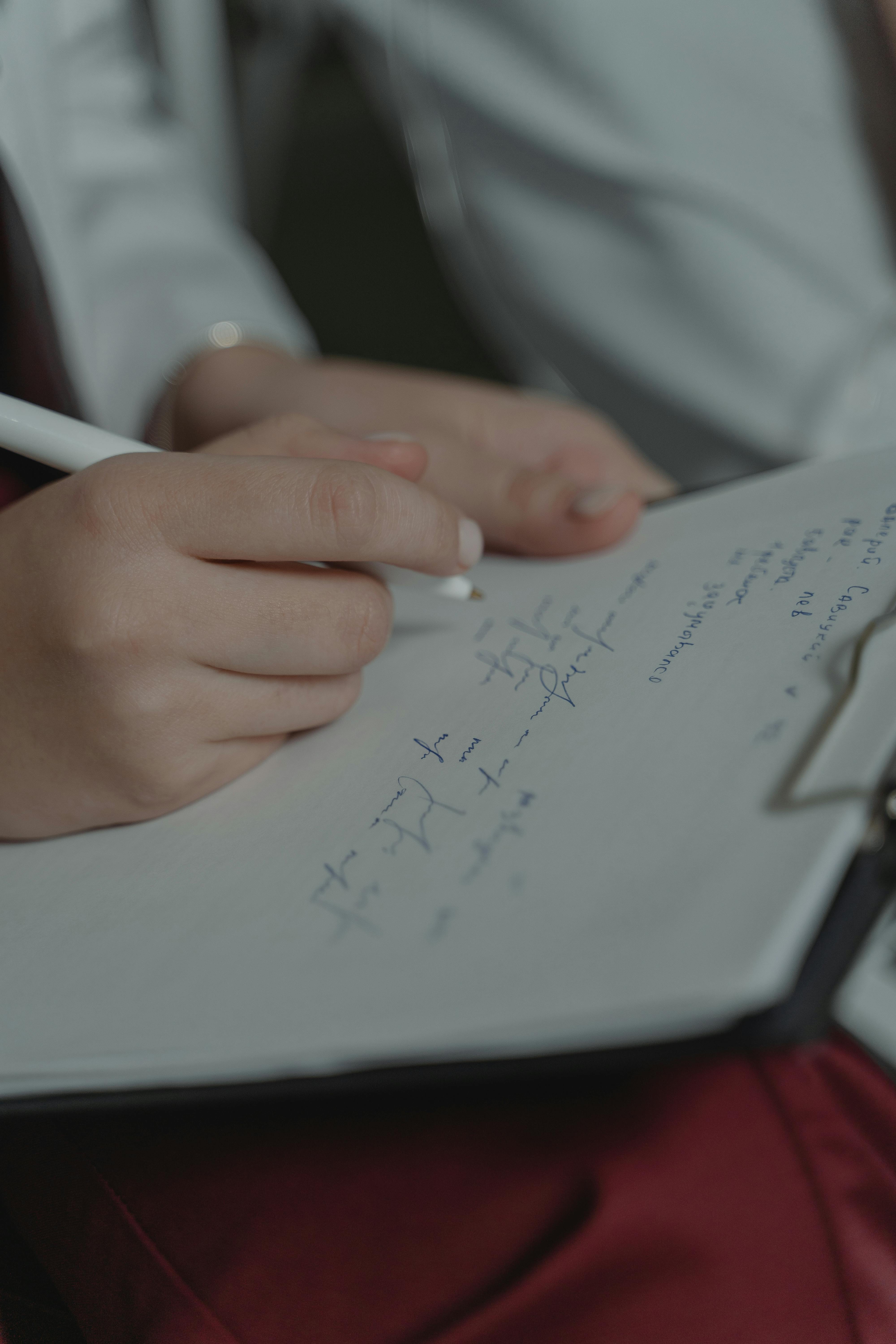 Person Writing on White Paper · Free Stock Photo