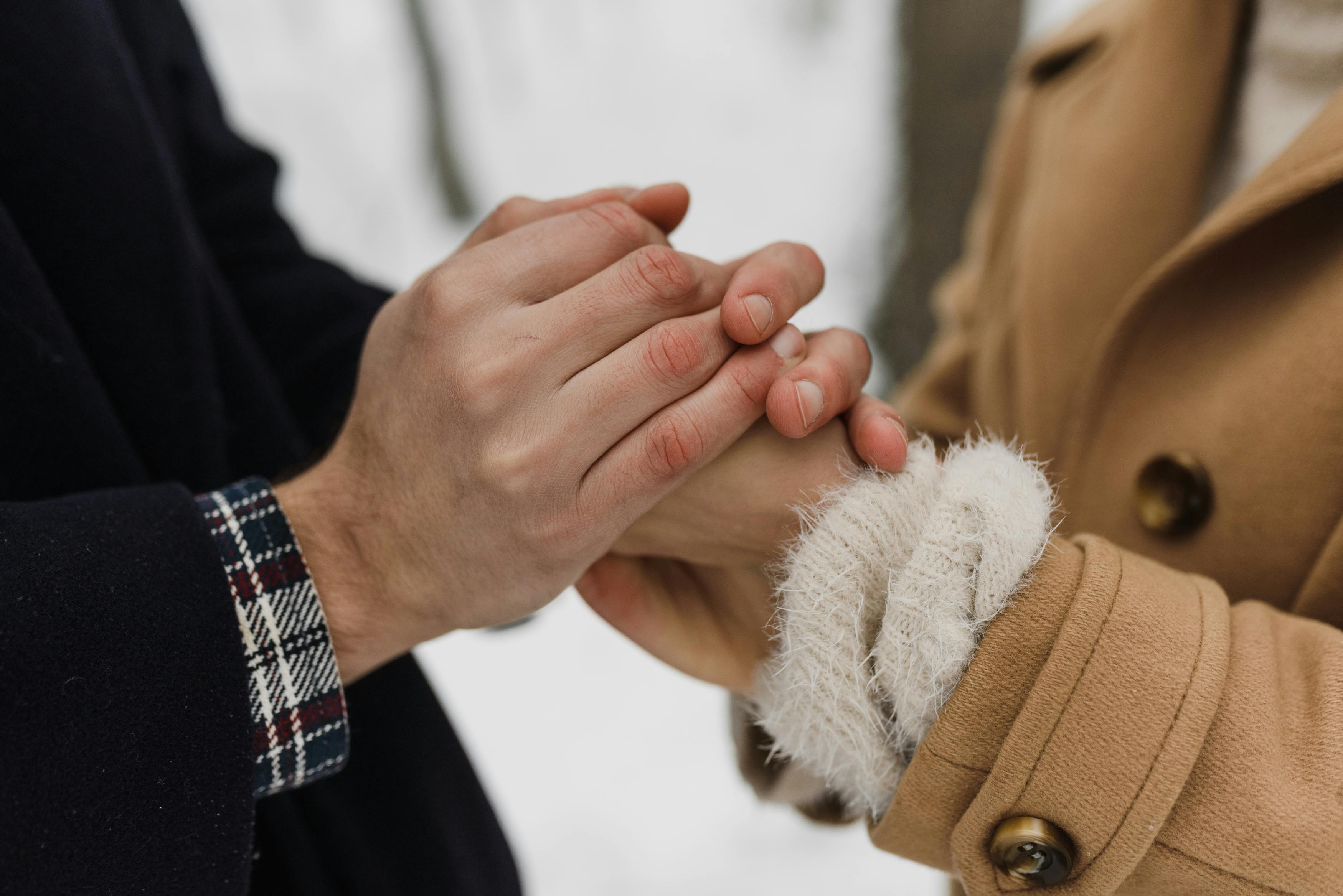 Close Up Shot of People Holding Hands · Free Stock Photo