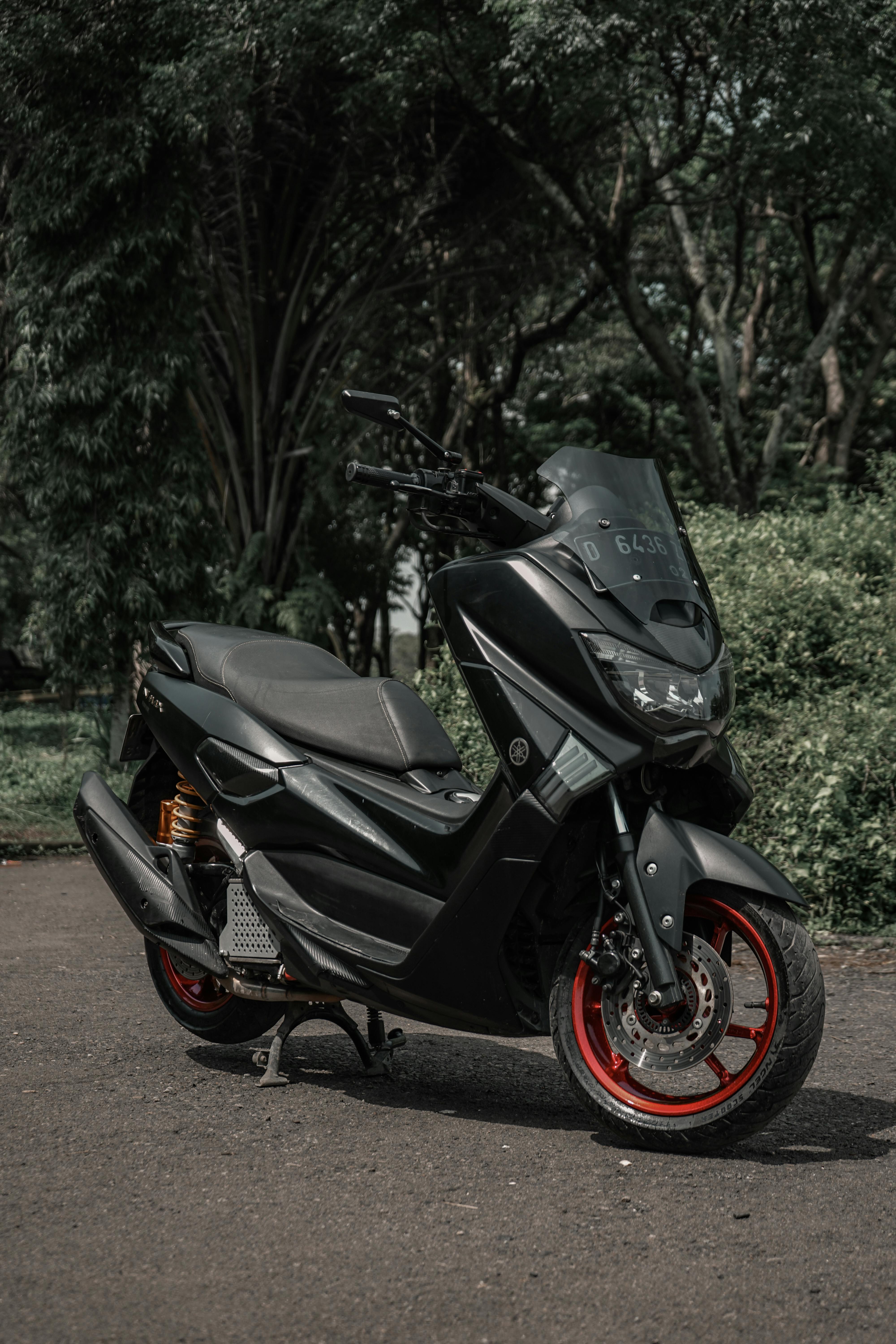 Black Motor Scooted Parked on the Street · Free Stock Photo