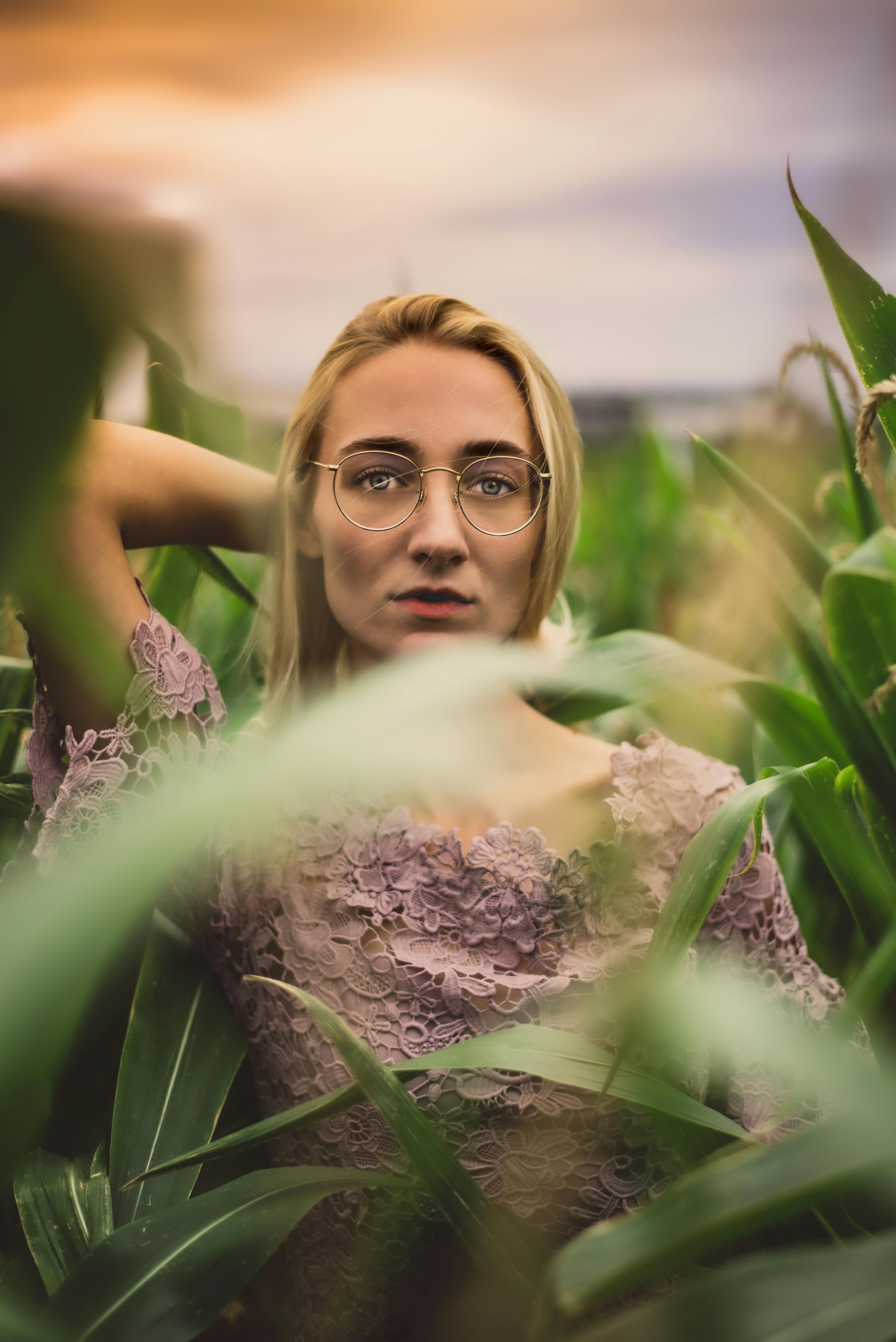 Woman Leaning Off Building Rim · Free Stock Photo