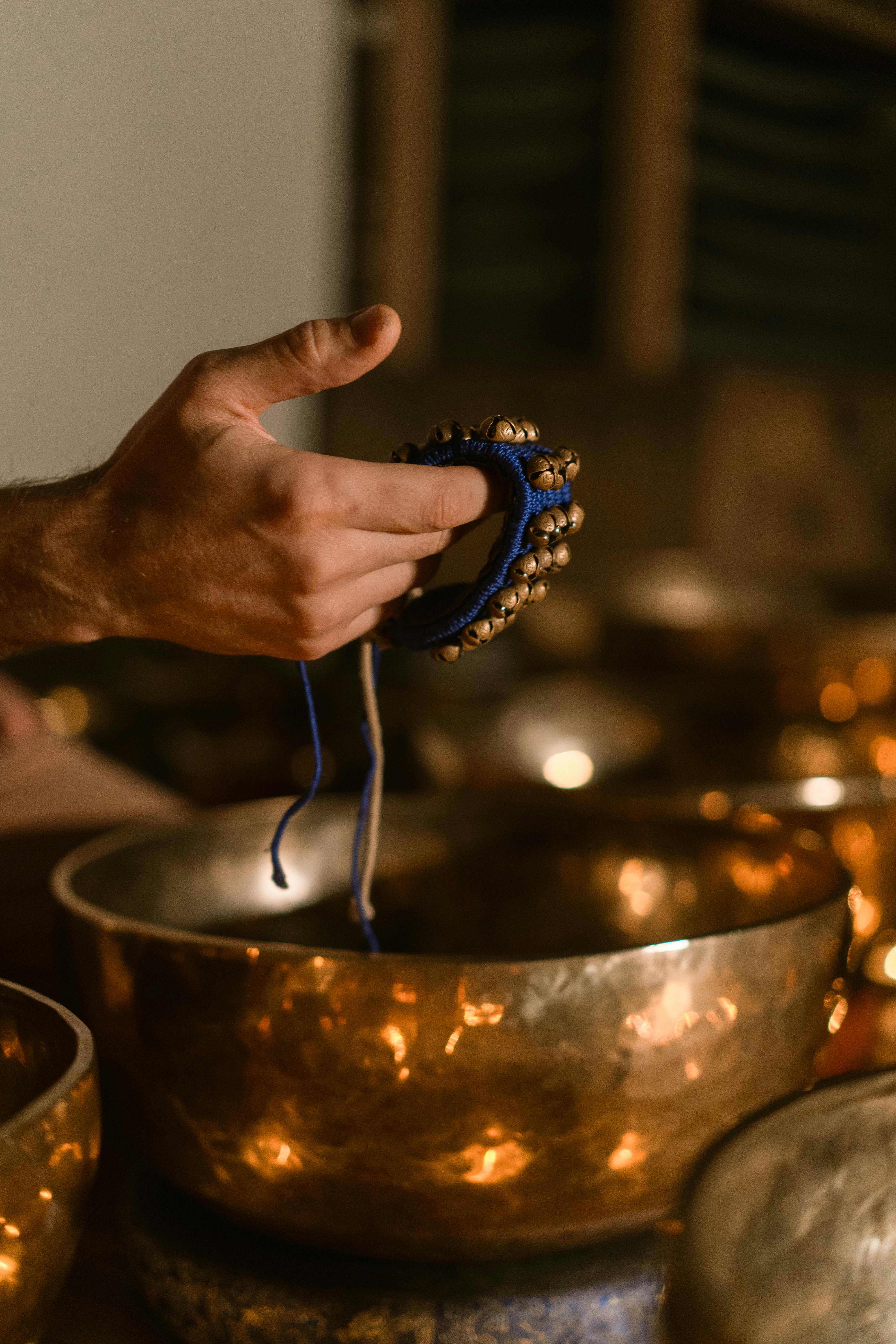 A Person Holding a Ghungroo · Free Stock Photo