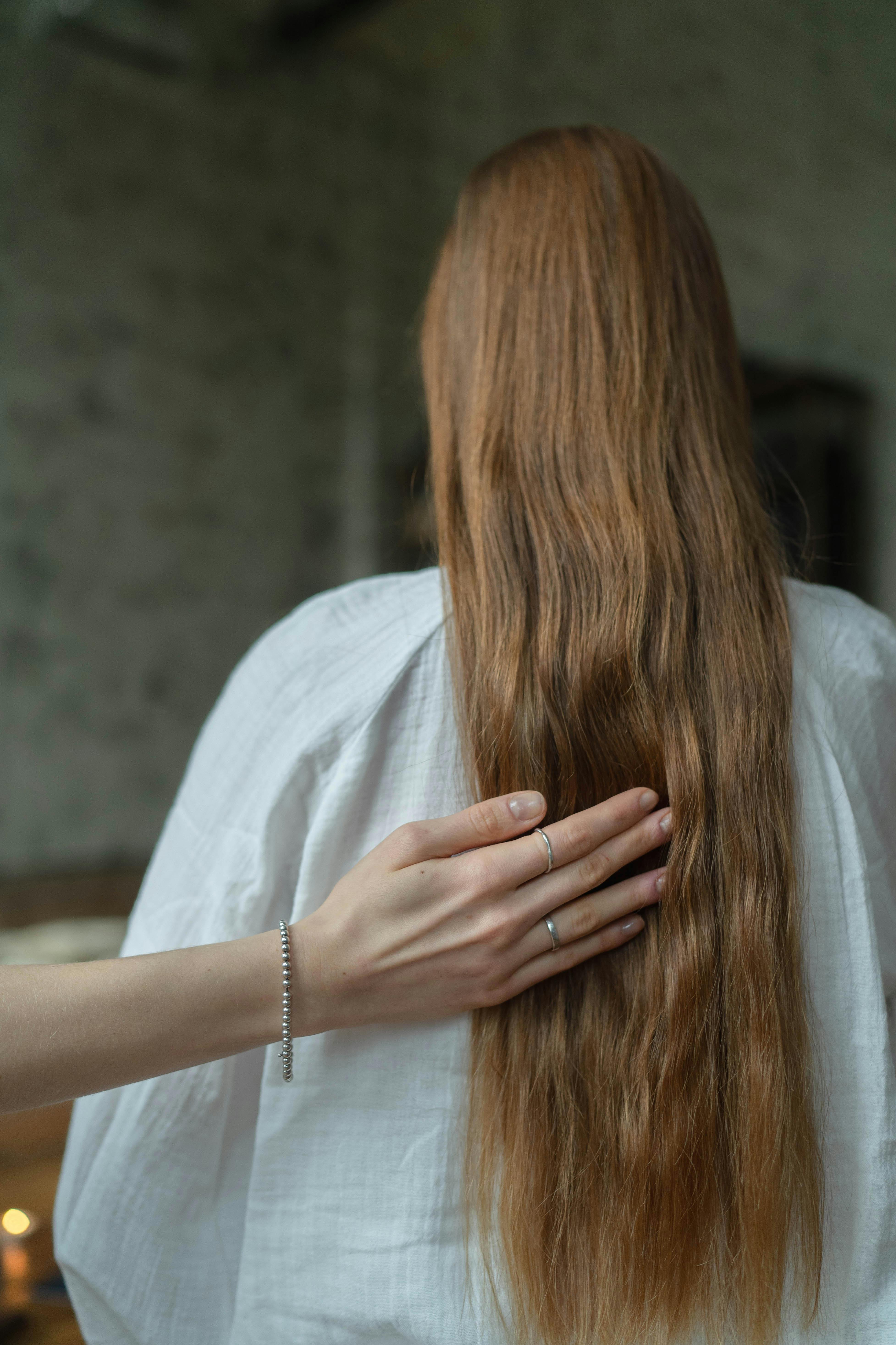 A Person Touching a Person's Long Hair · Free Stock Photo