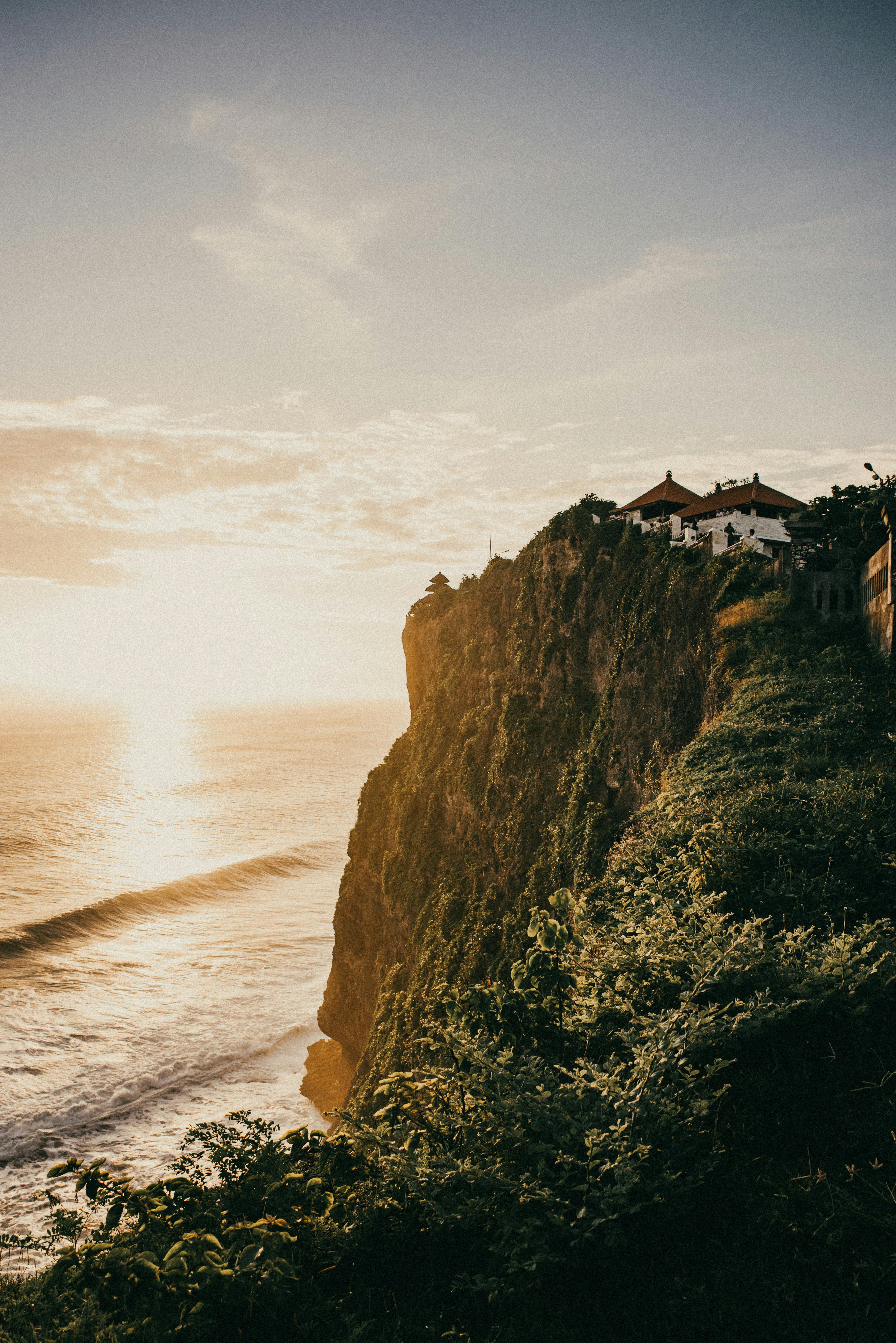 Brown Rock Mountain Near Body of Water · Free Stock Photo