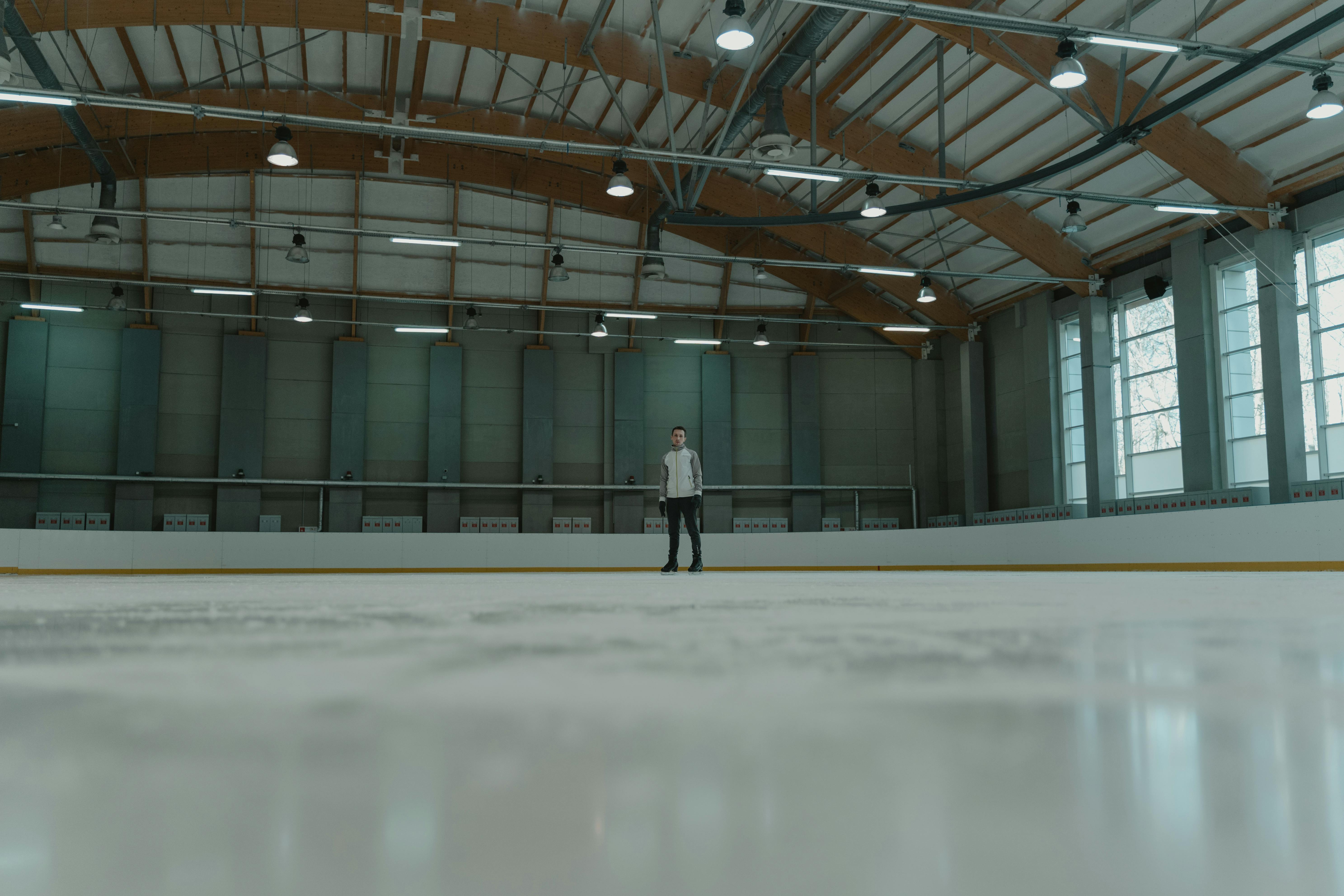 Man Standing Inside an Ice Rink · Free Stock Photo