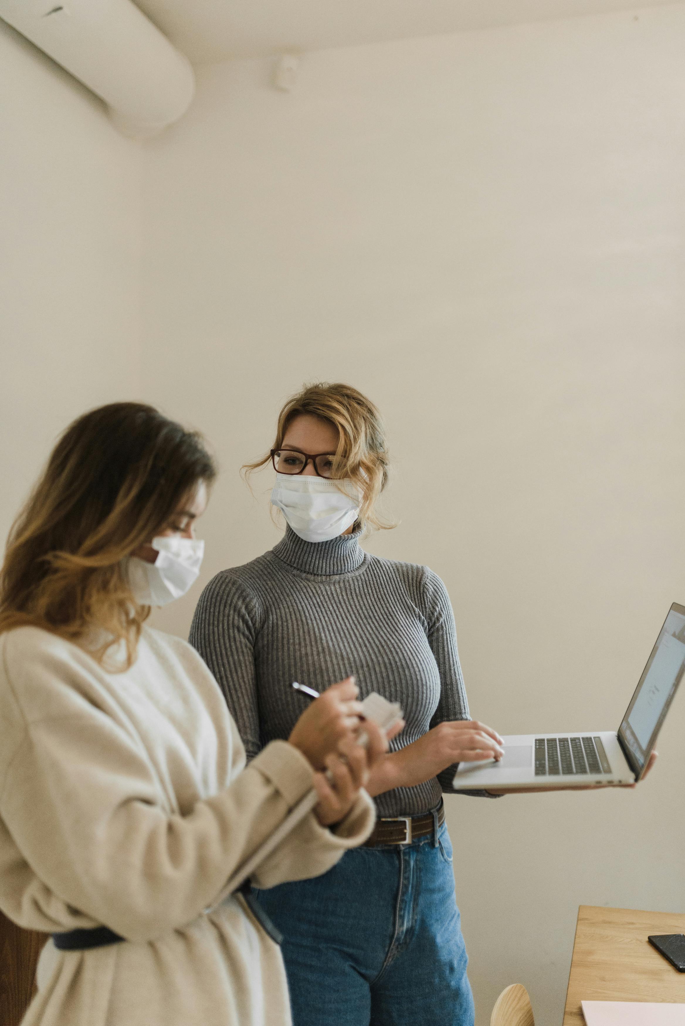 Women Wearing Face Masks Using Laptop · Free Stock Photo
