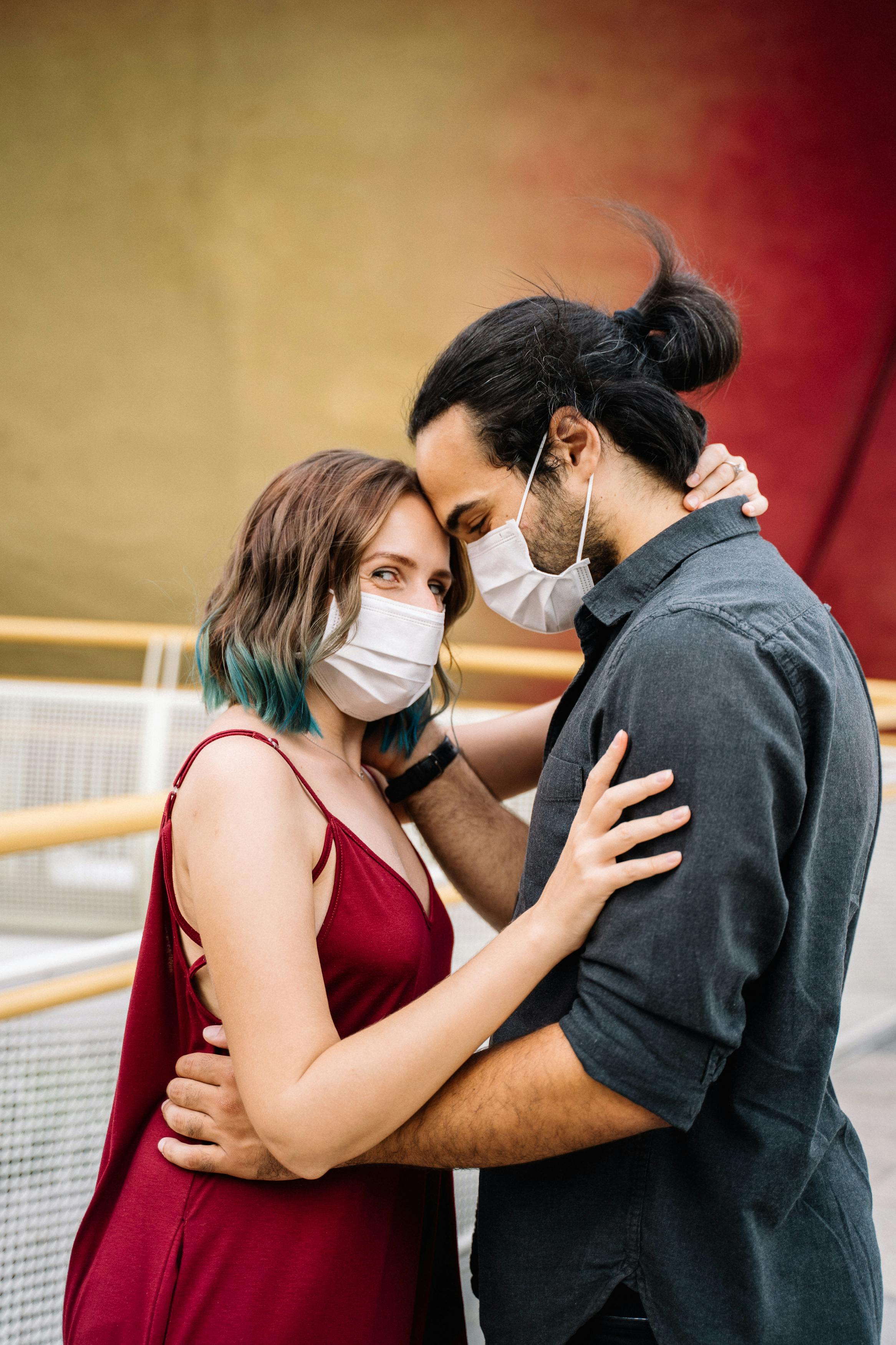 A Couple Wearing Face Masks Standing Close Together · Free Stock Photo
