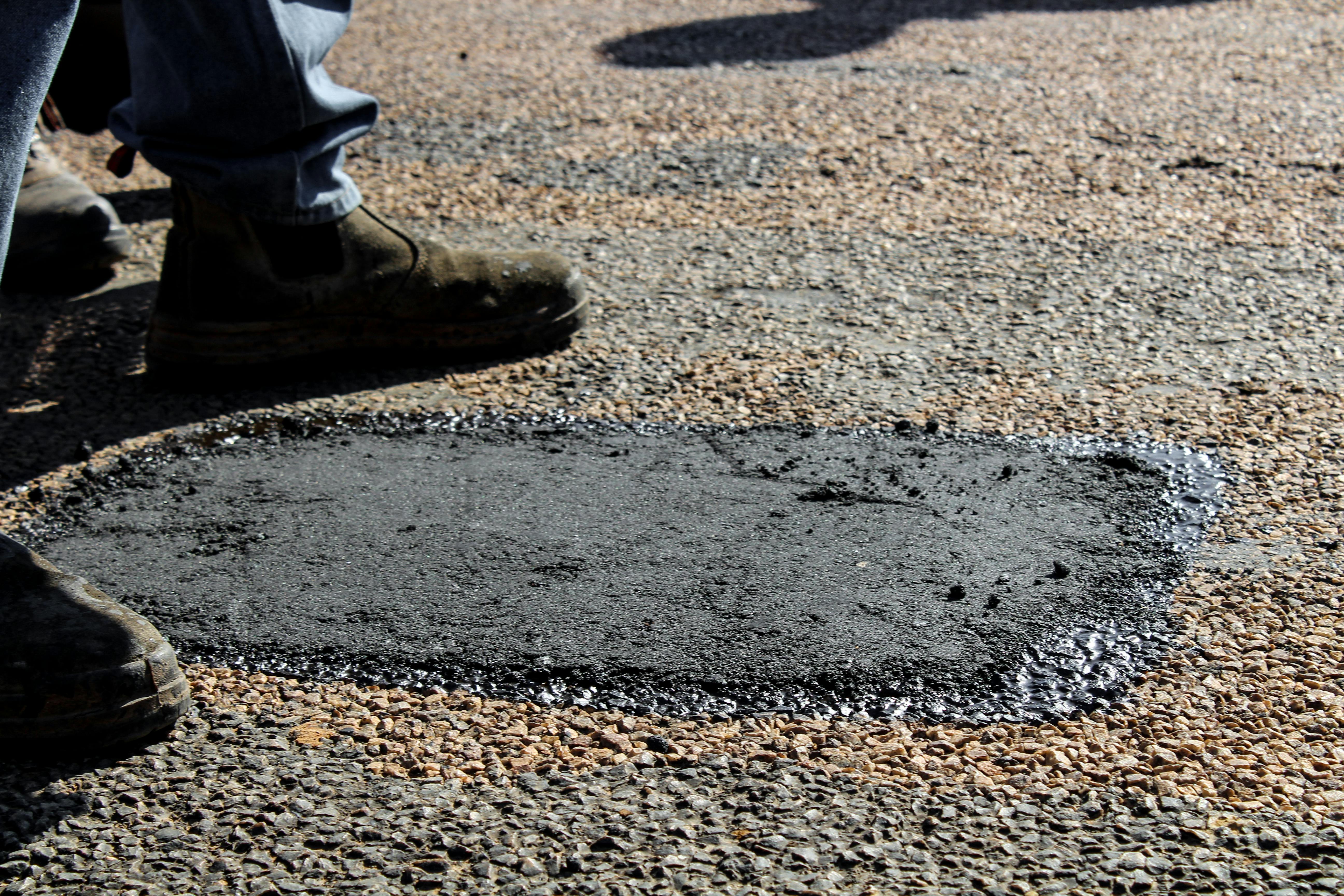 Patched Hole in the Road · Free Stock Photo