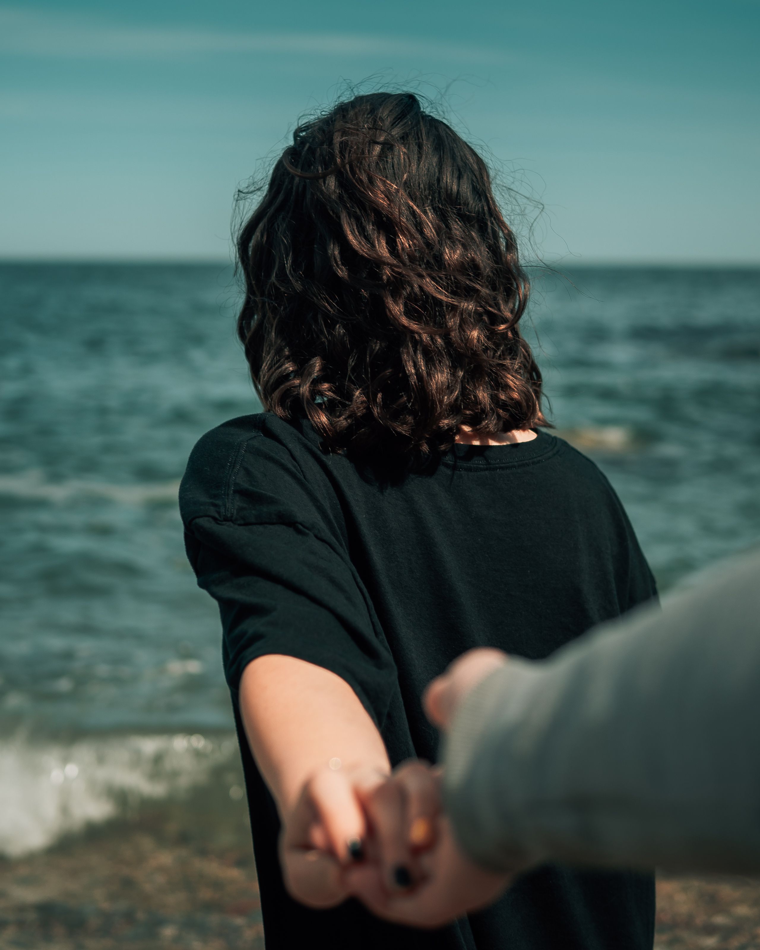 A Person in Black Shirt Holding the Hand of a Person Behind · Free ...
