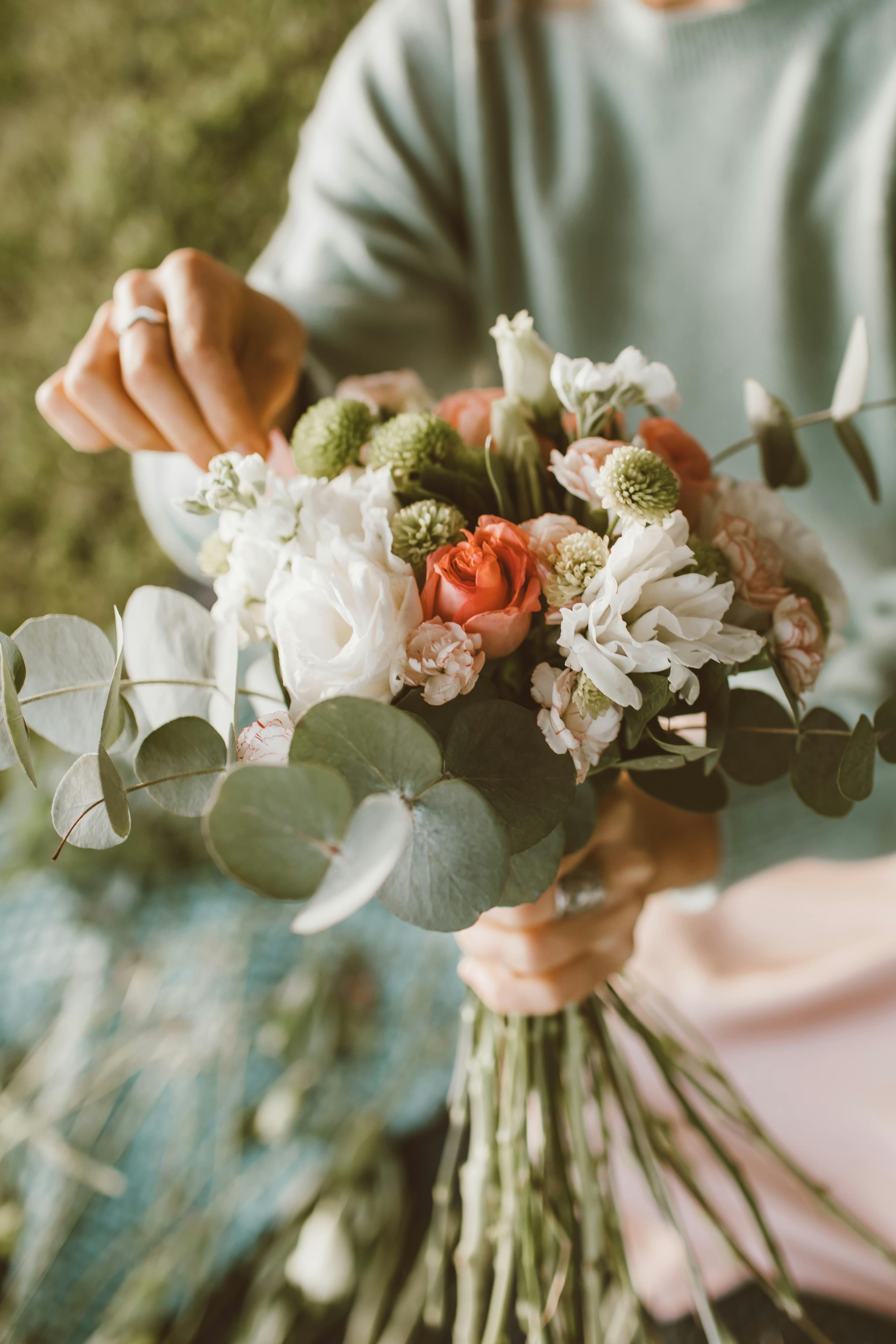 Close-Up Photo of a Person Arranging Flowers · Free Stock Photo