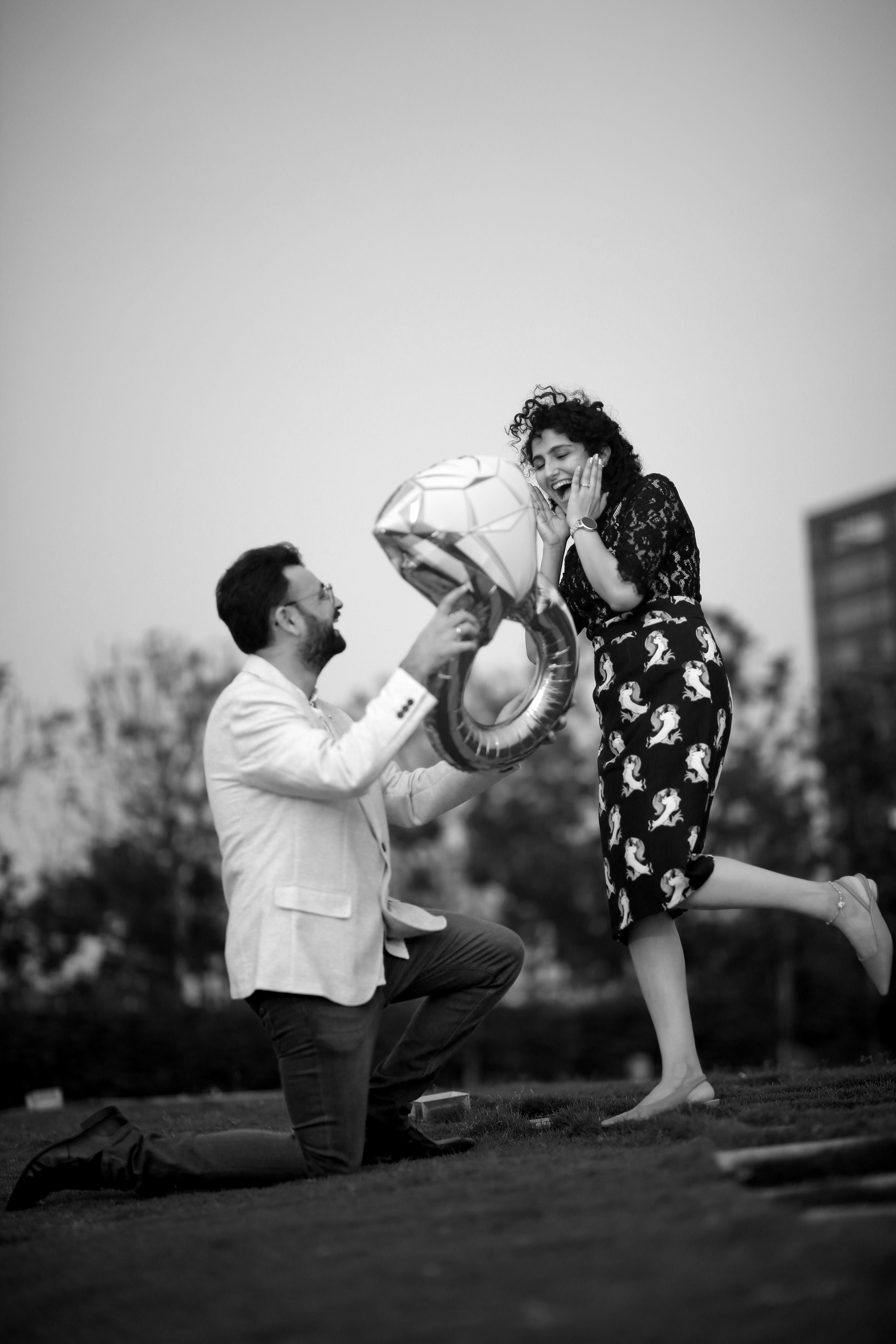 Monochrome Shot of a Man Proposing to His Woman · Free Stock Photo