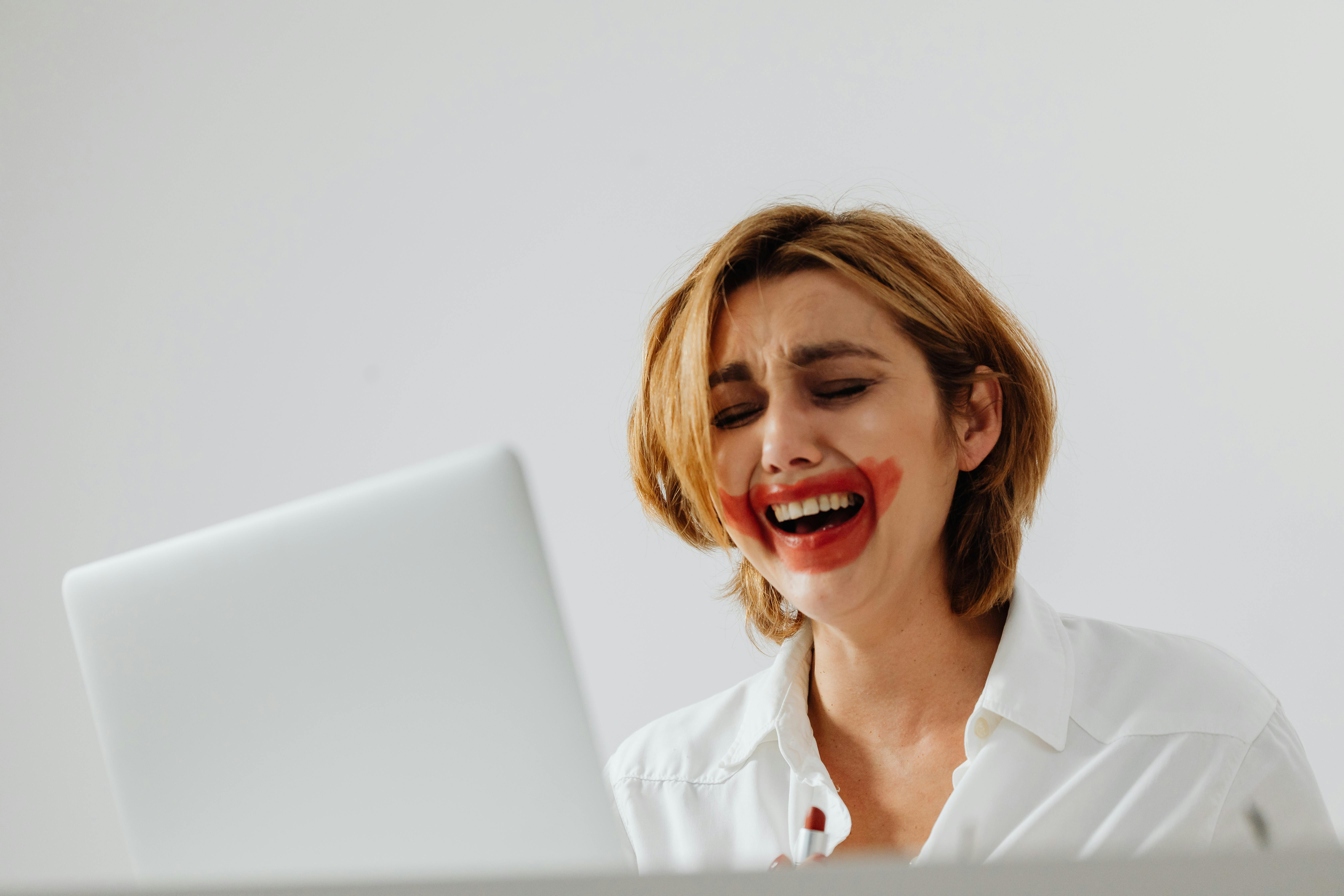 Crying Woman with her Face Smeared with Red Lipstick · Free Stock Photo