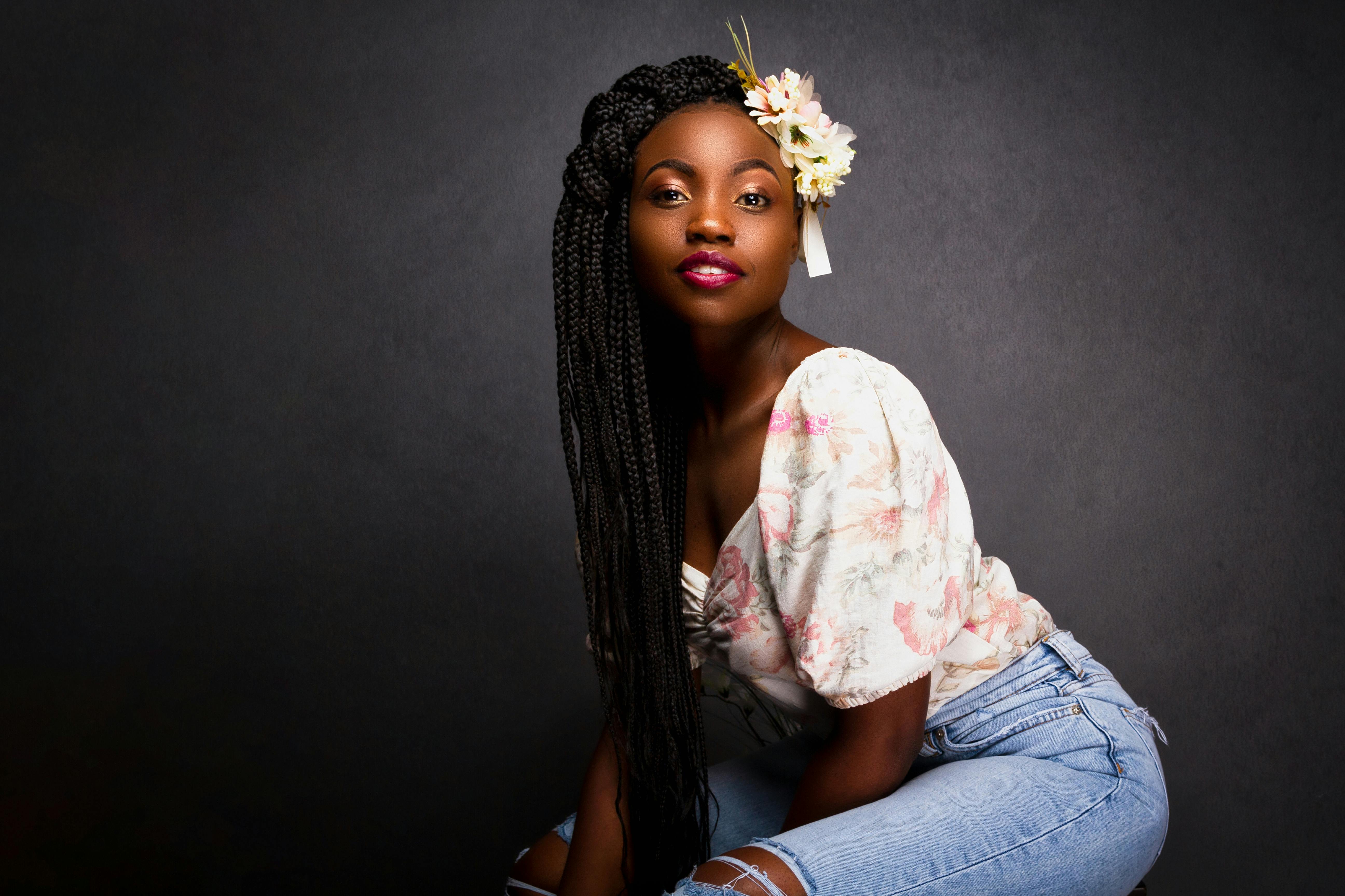 Woman Wearing a Floral Top in a Photoshoot · Free Stock Photo